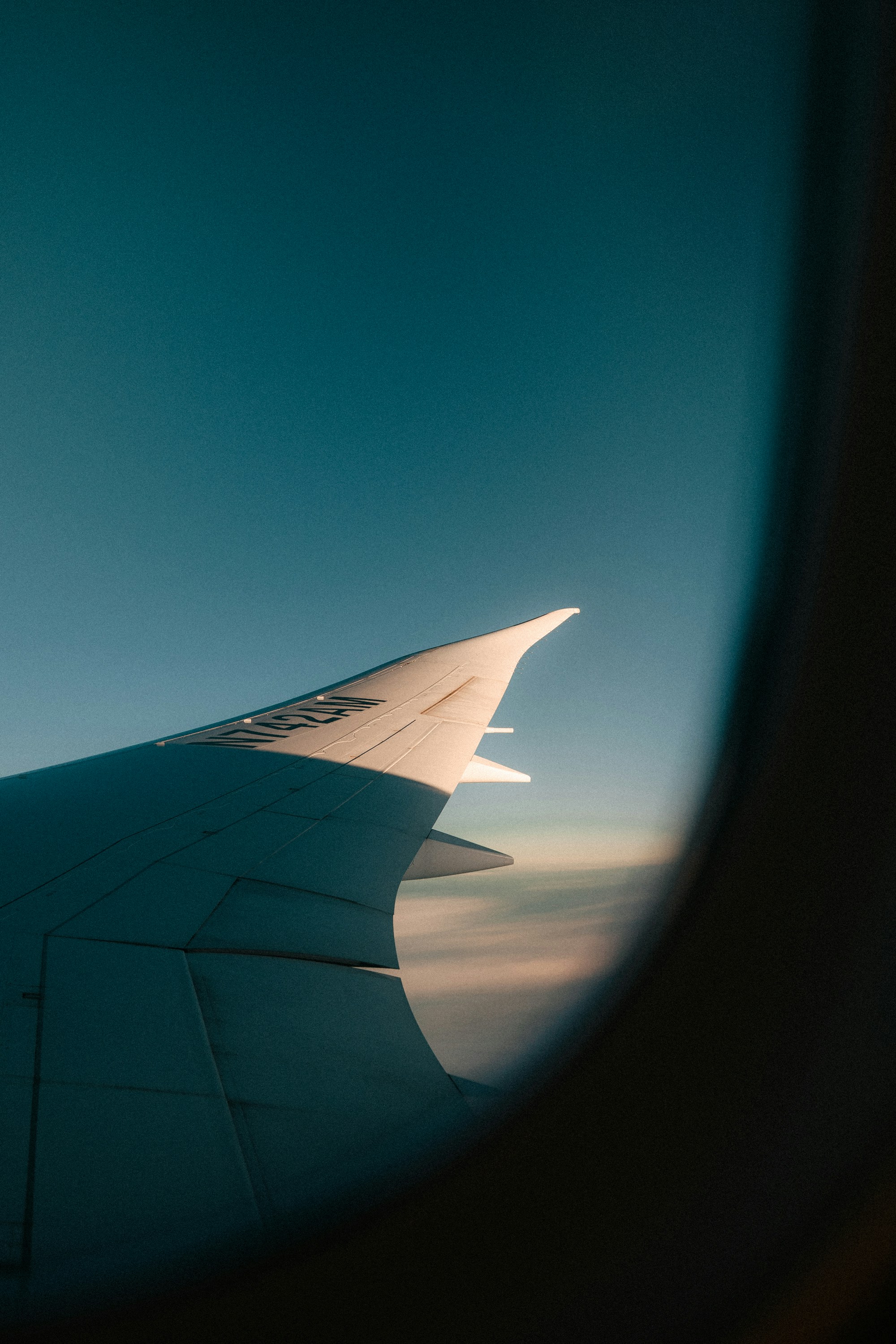 Wingtip in Twilight: A Quiet Flight Over the Clouds