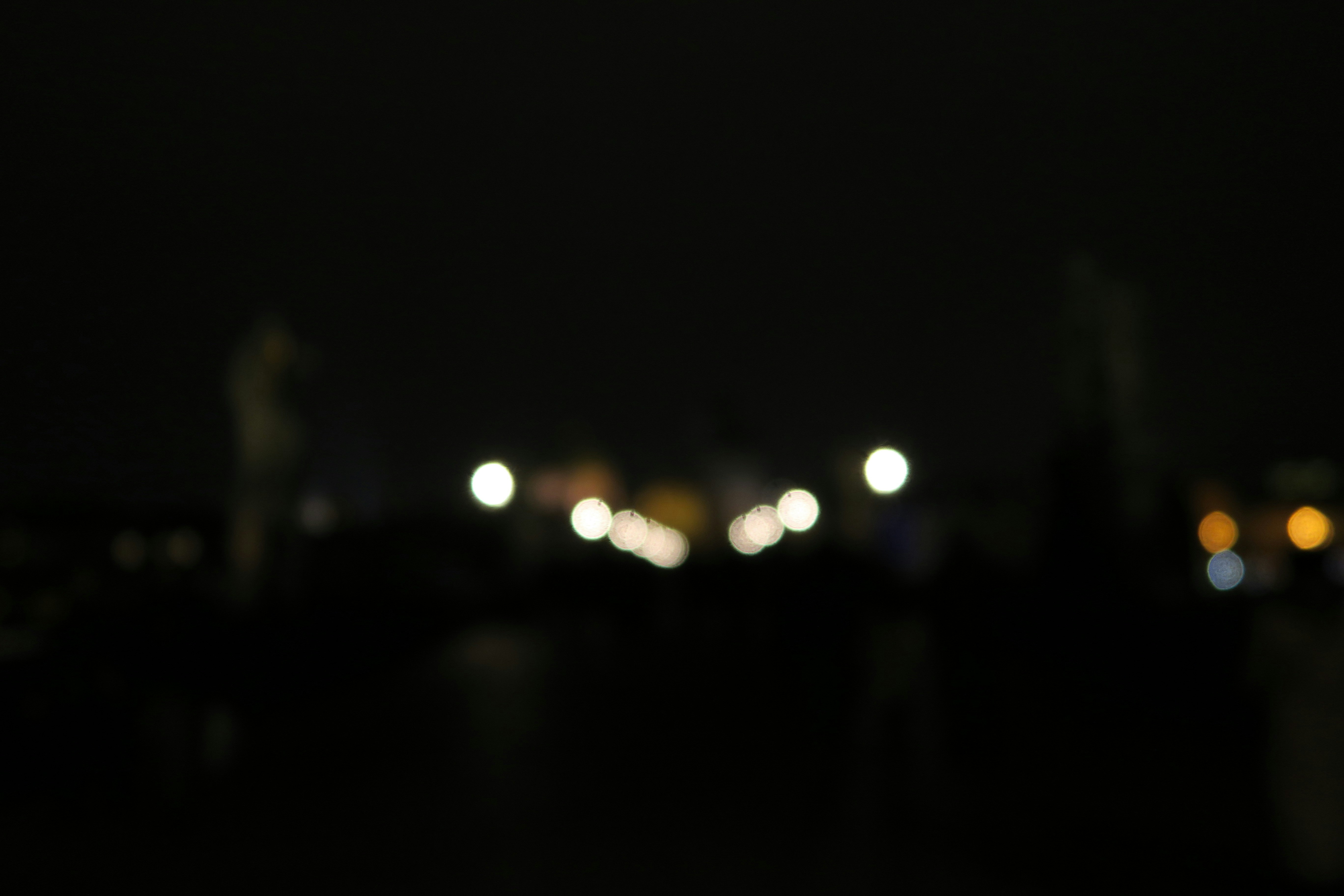Blurred Night Lights Over a Quiet Waterfront