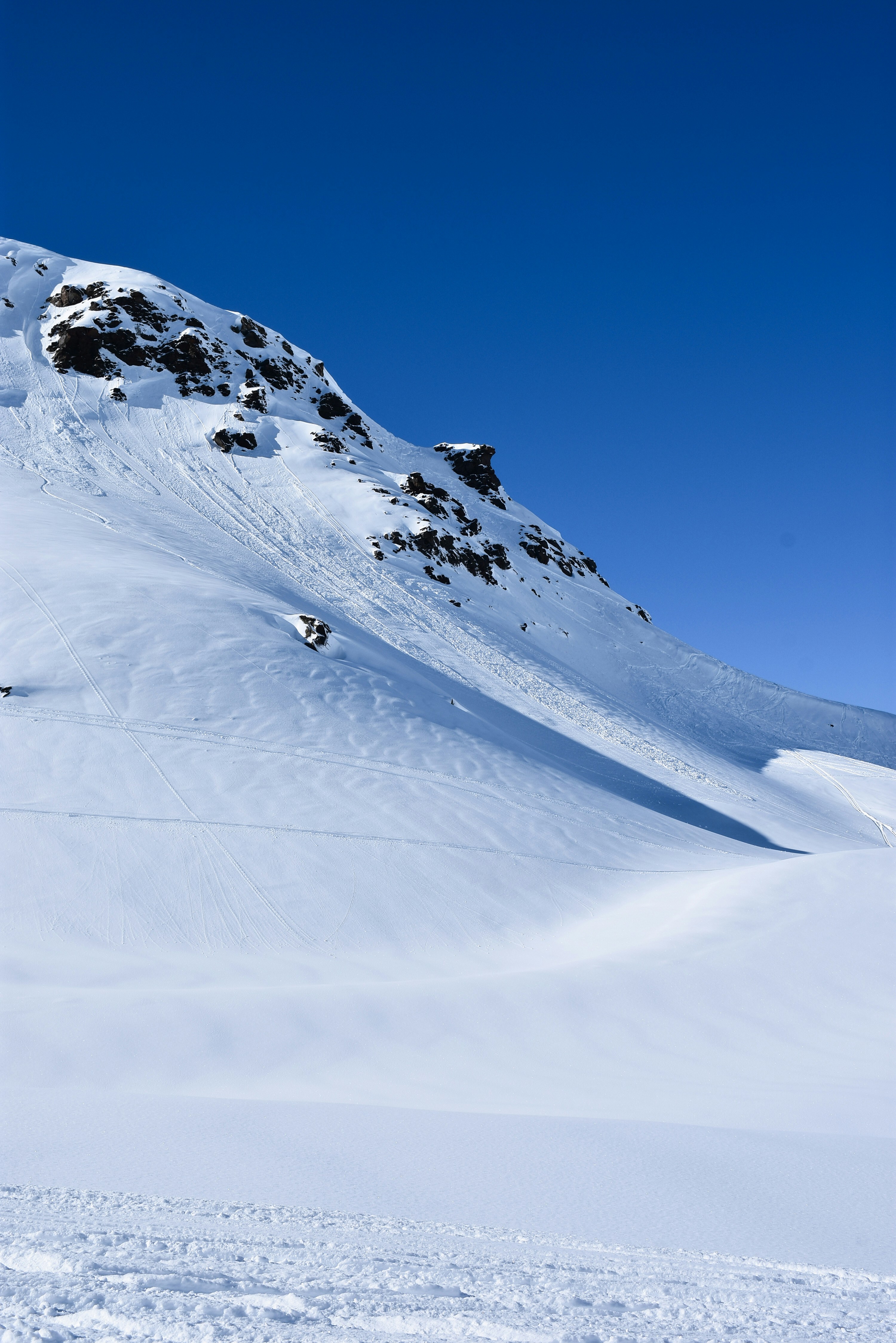 Snowbound Summit Under A Brisk Alpine Sky