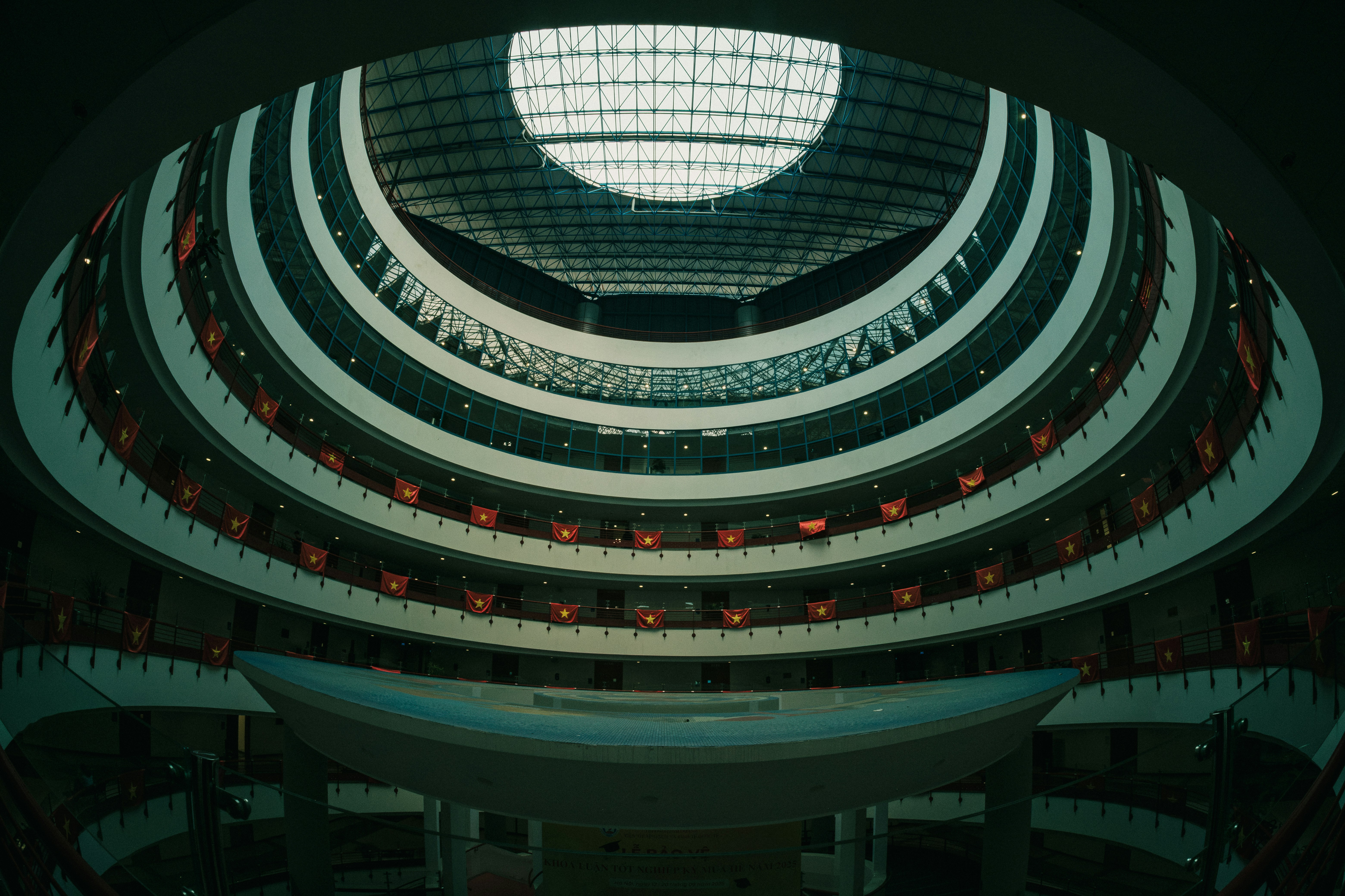 Symmetrical Atrium: Concentric Circles Reaching Toward the Glass Dome