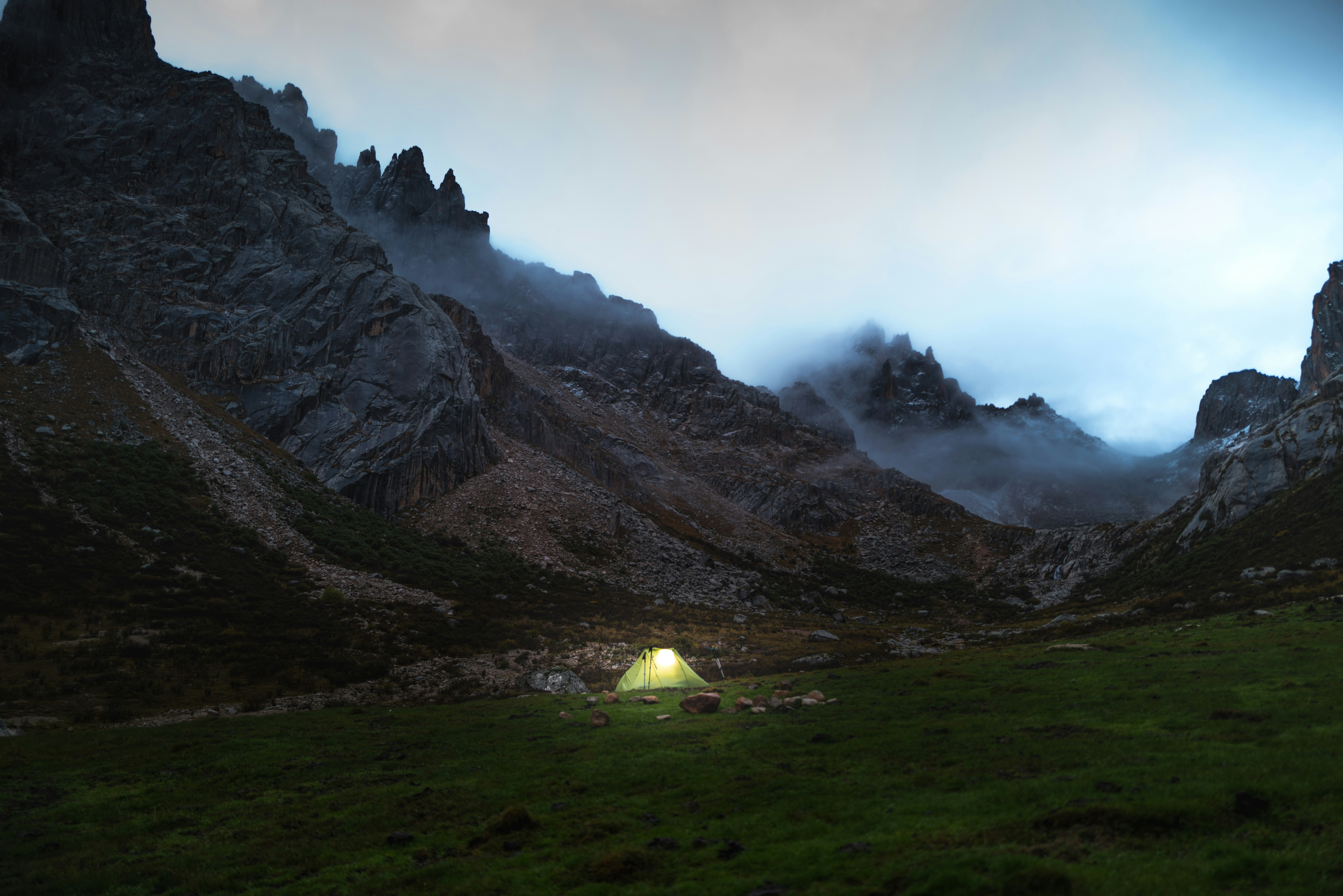 Lone Tent Amid Mountain Veil: A Quiet Night in the Basin