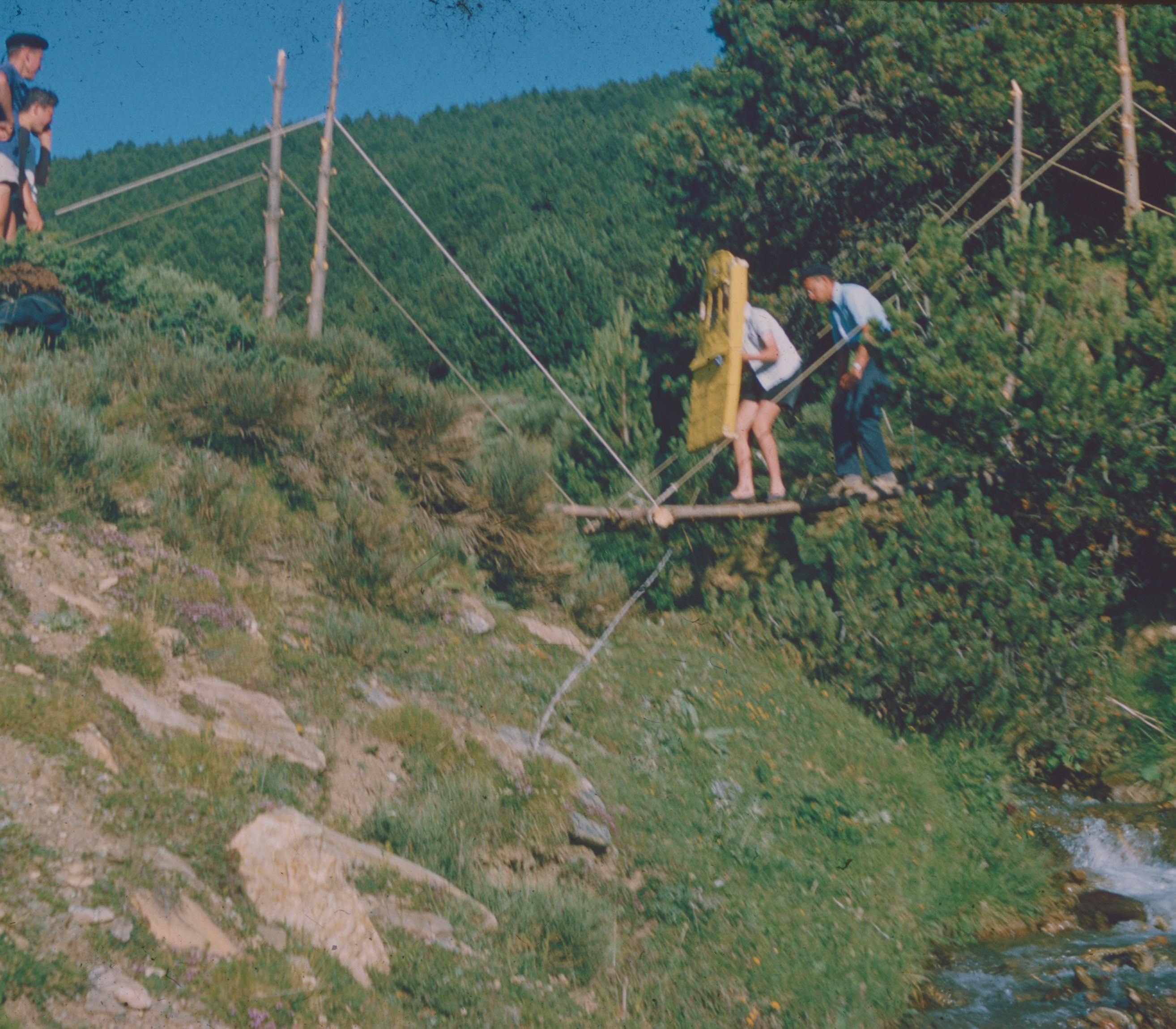 Highline on the Ridge: Youths Assemble for a Cliffside Bridge Traverse