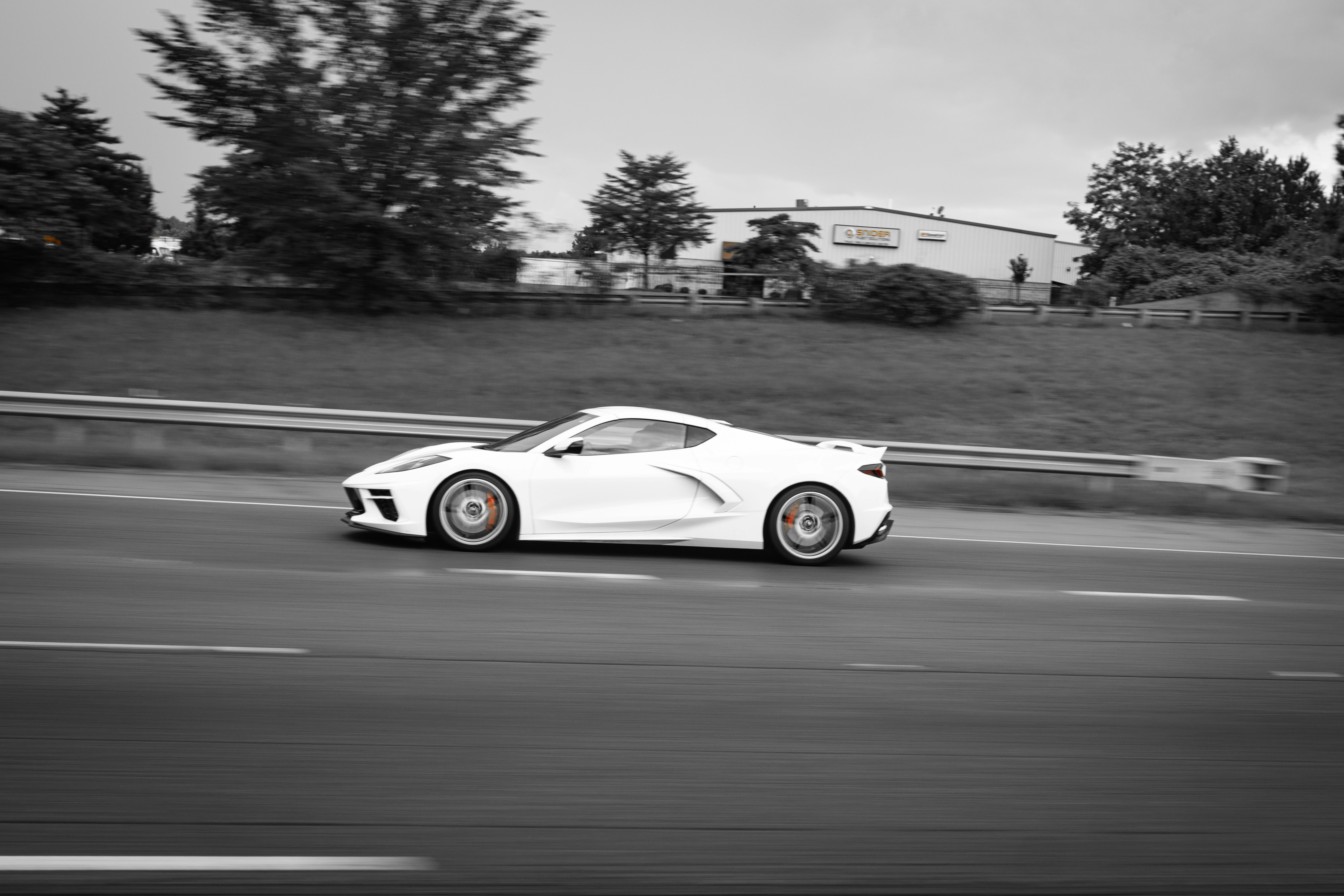 Sleek White Hypercar in Forward Blur on the Highway