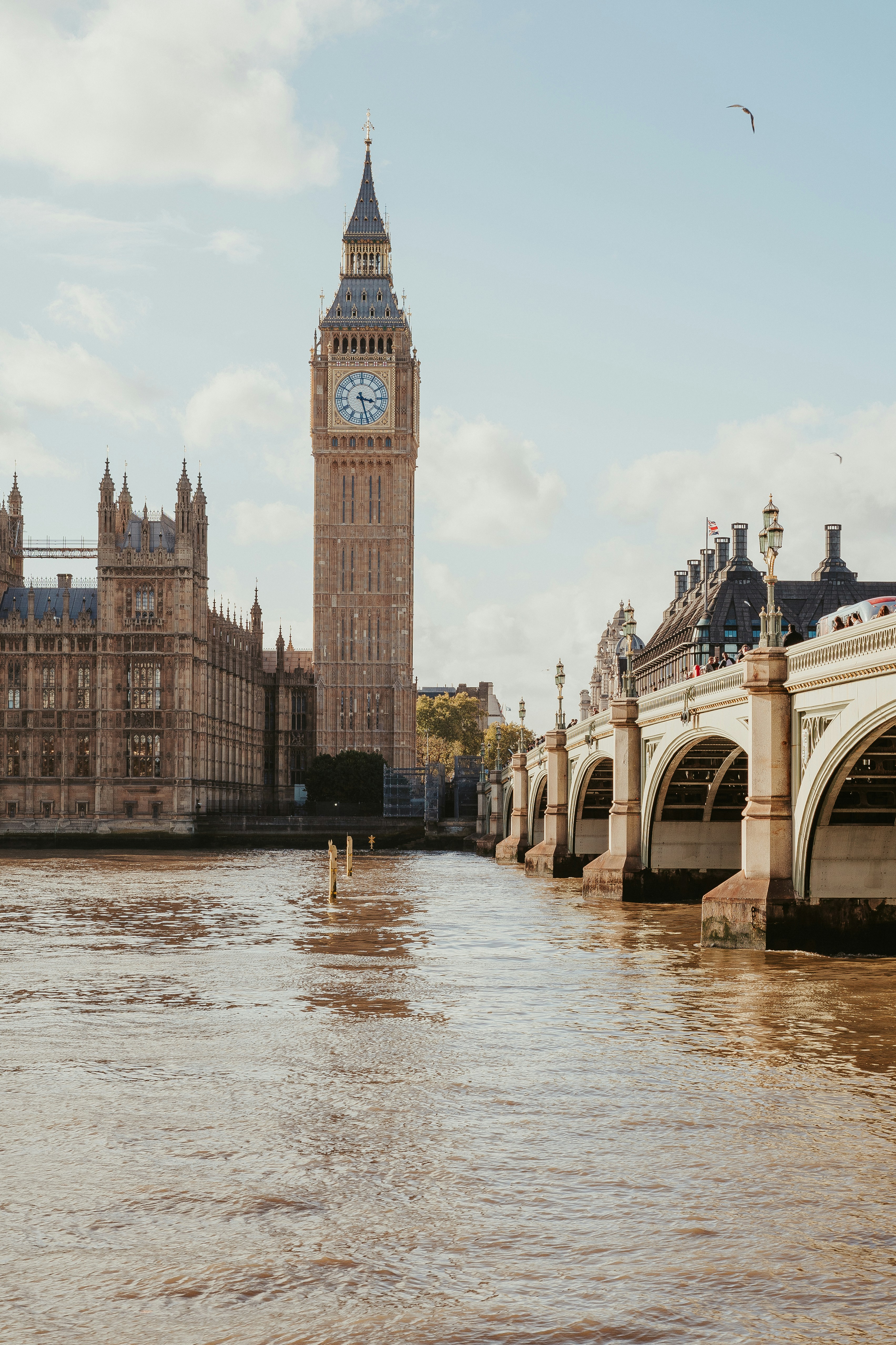 Clock Tower Over Westminster: River, Bridge, and Skyline