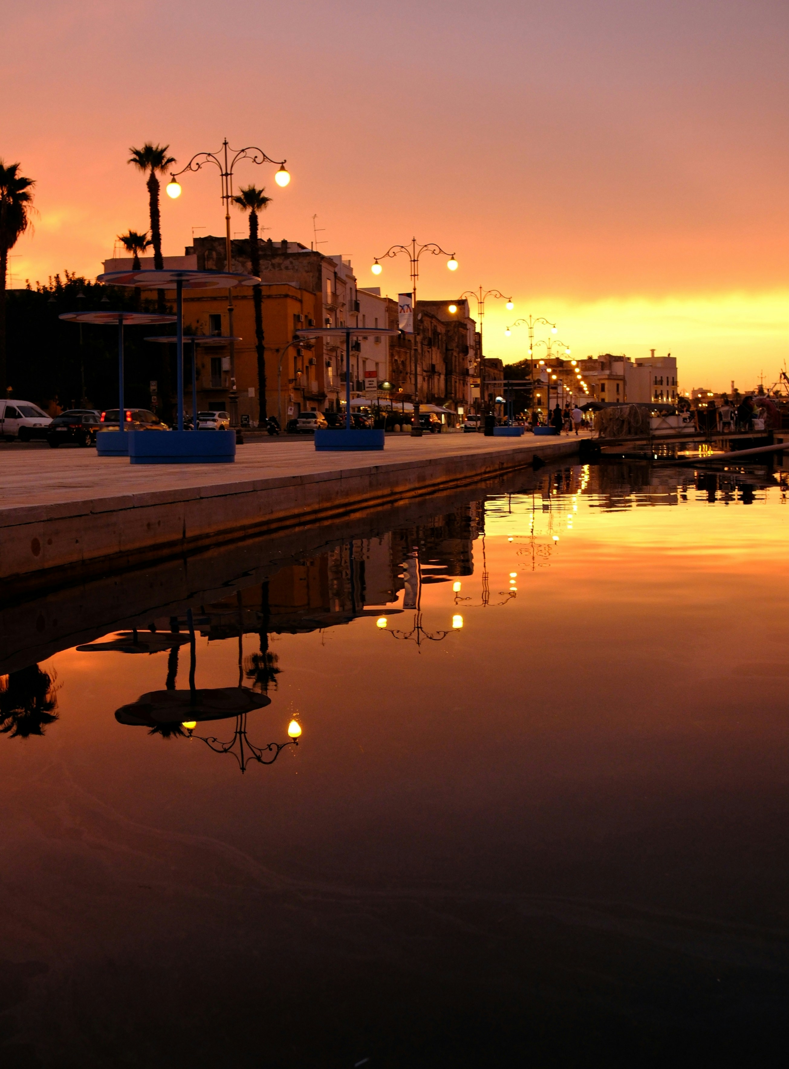 Golden Hour along a Lantern-Lined Harbor