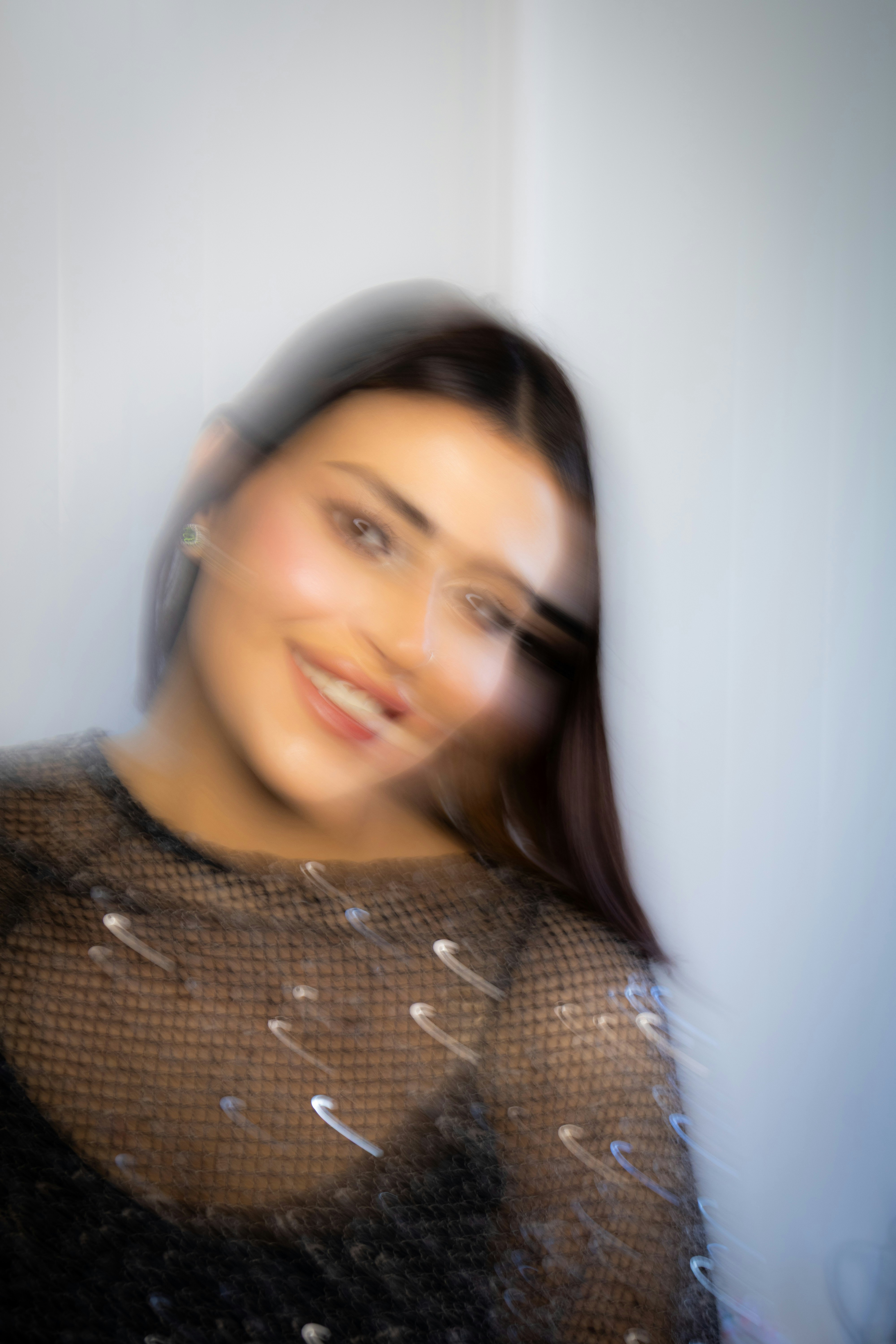 Soft Blur, Bright Smile: A Playful Portrait in Motion