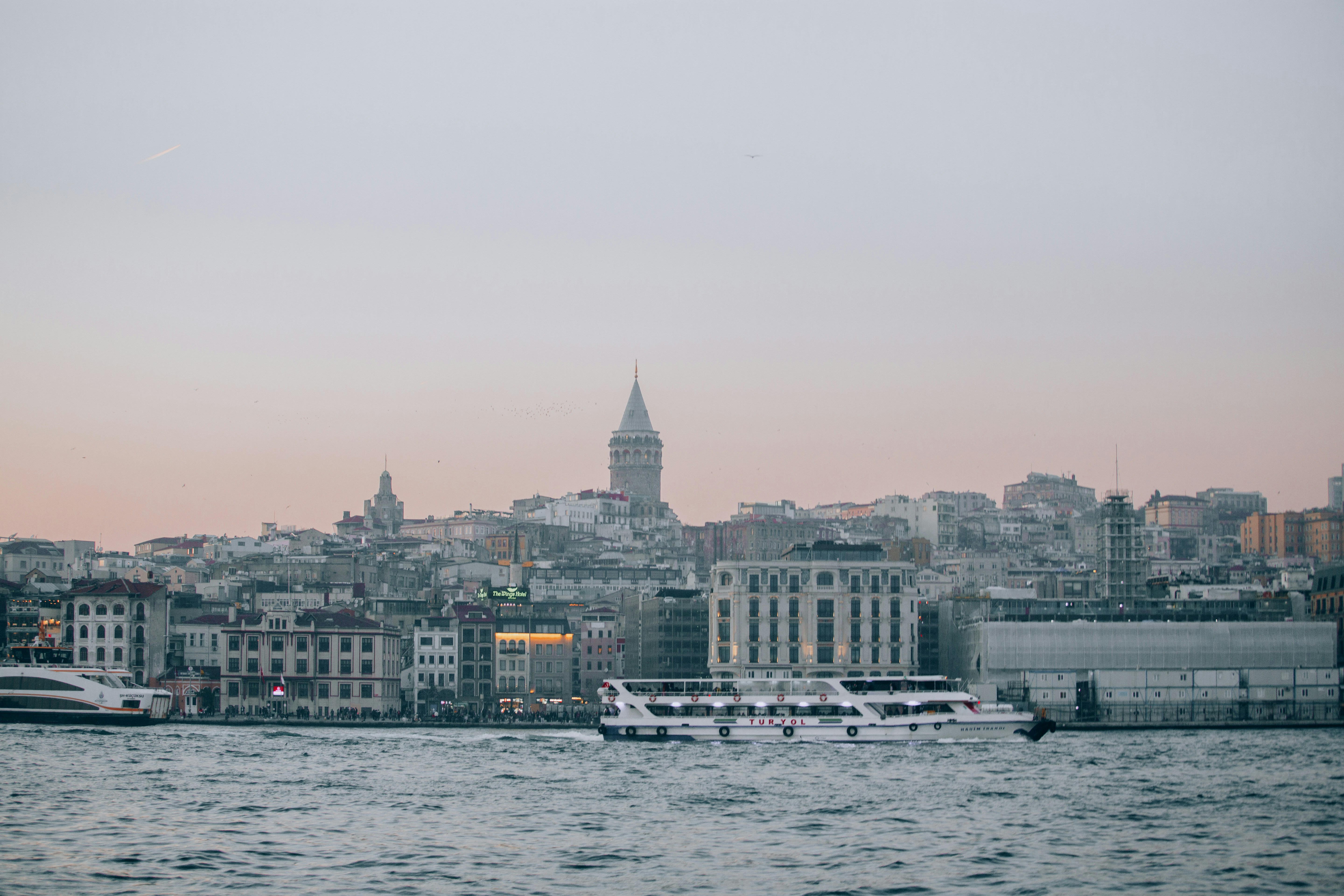 Harbor Silhouette: Historic skyline and ferry at golden hour