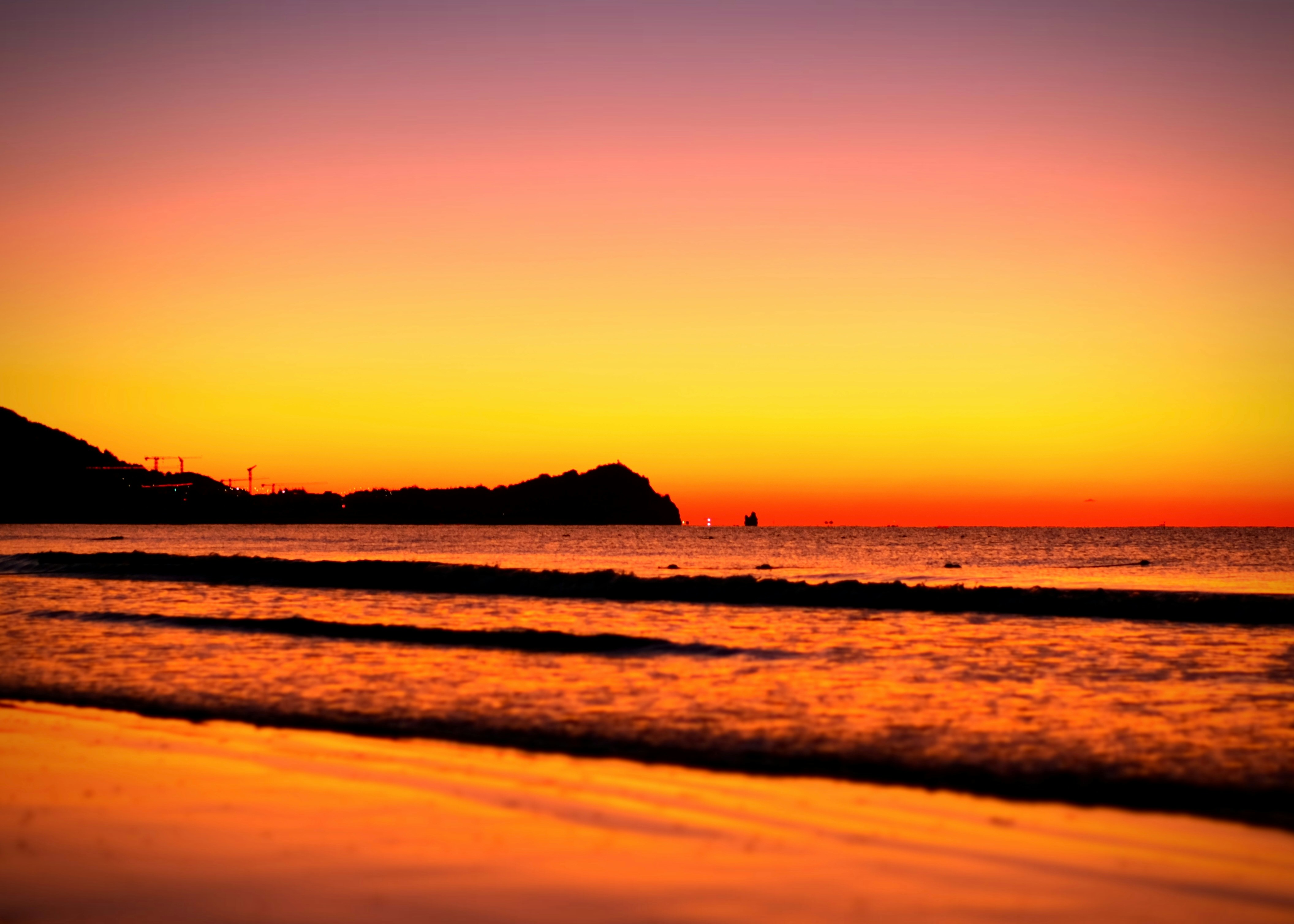Crimson Shore at Dusk: A Calm Edge Between Sea and Sky