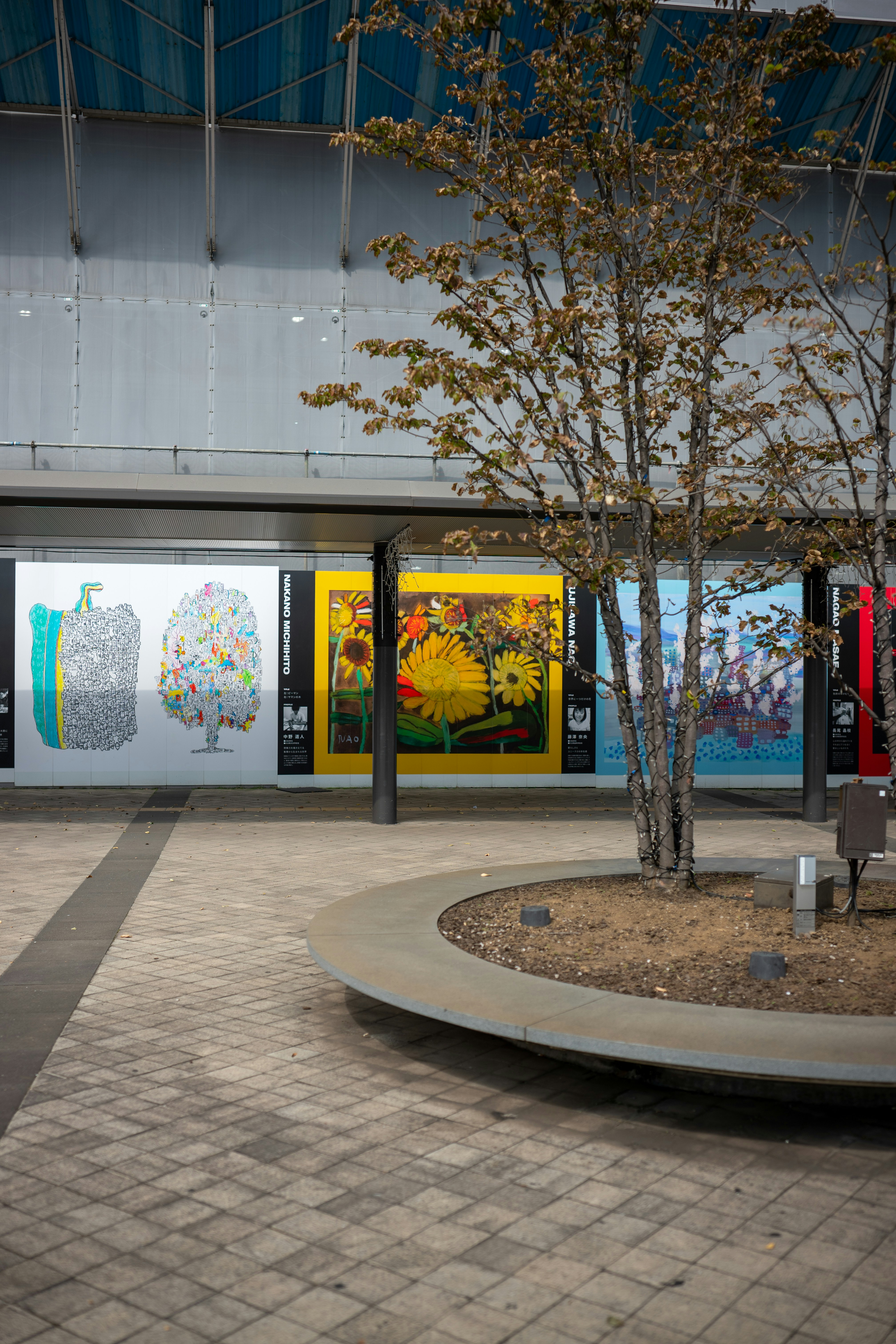 Gallery Window Bloom: Sunflower Panel under a Canopy of Steel