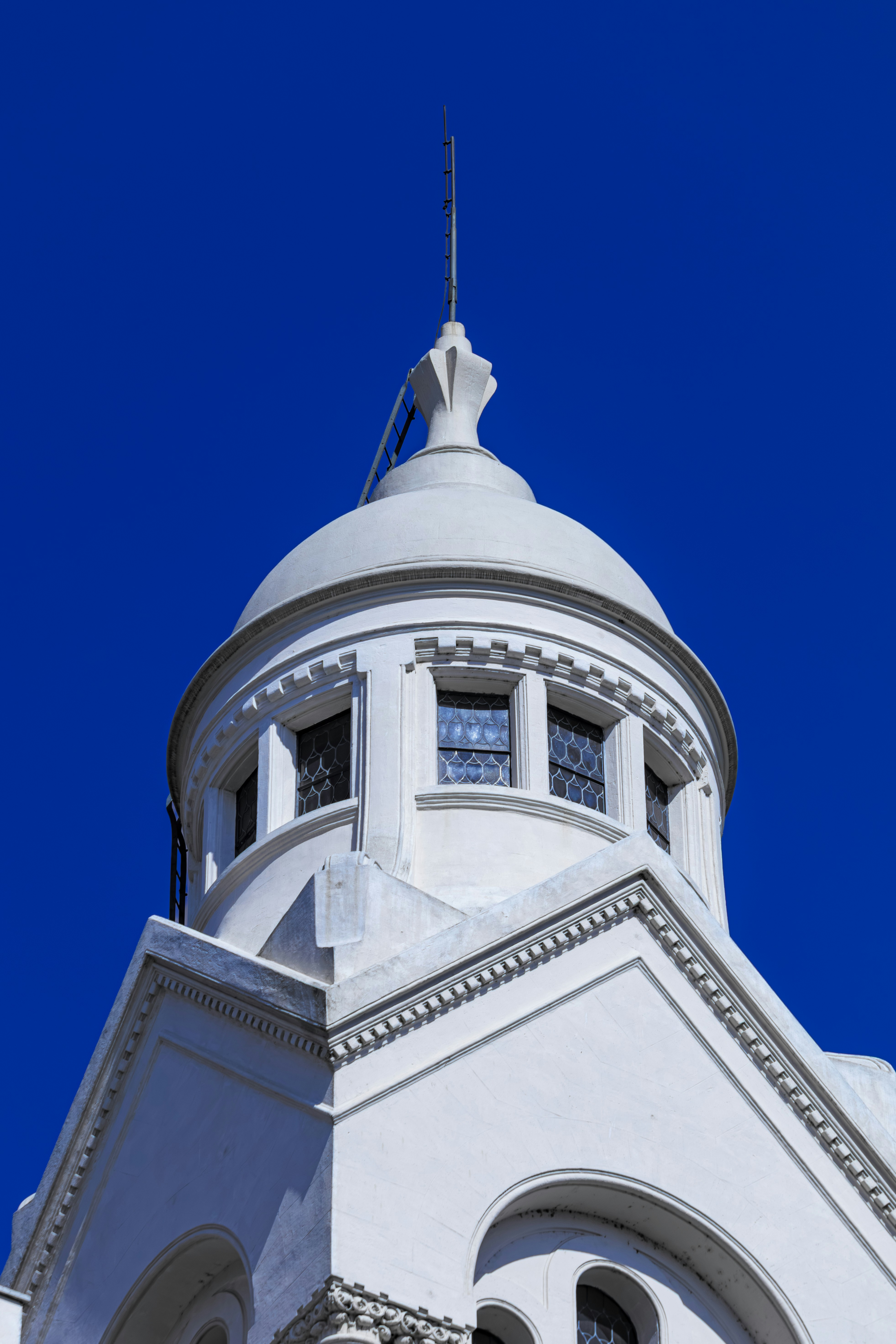 White Dome Against the Azure Sky: Architectural Spire Reaching Up