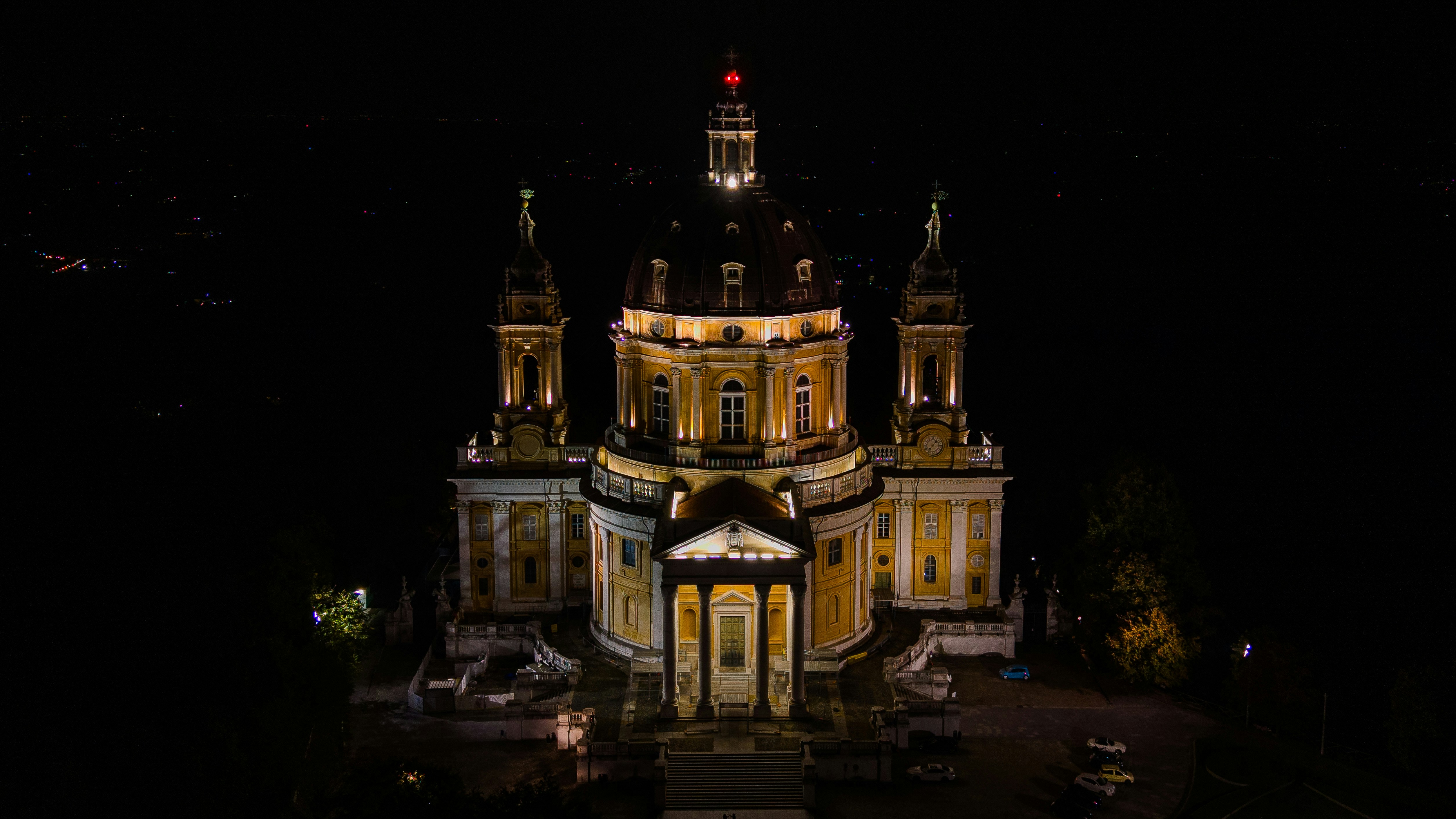 Illuminated Baroque Church Emerges from Night Shadows