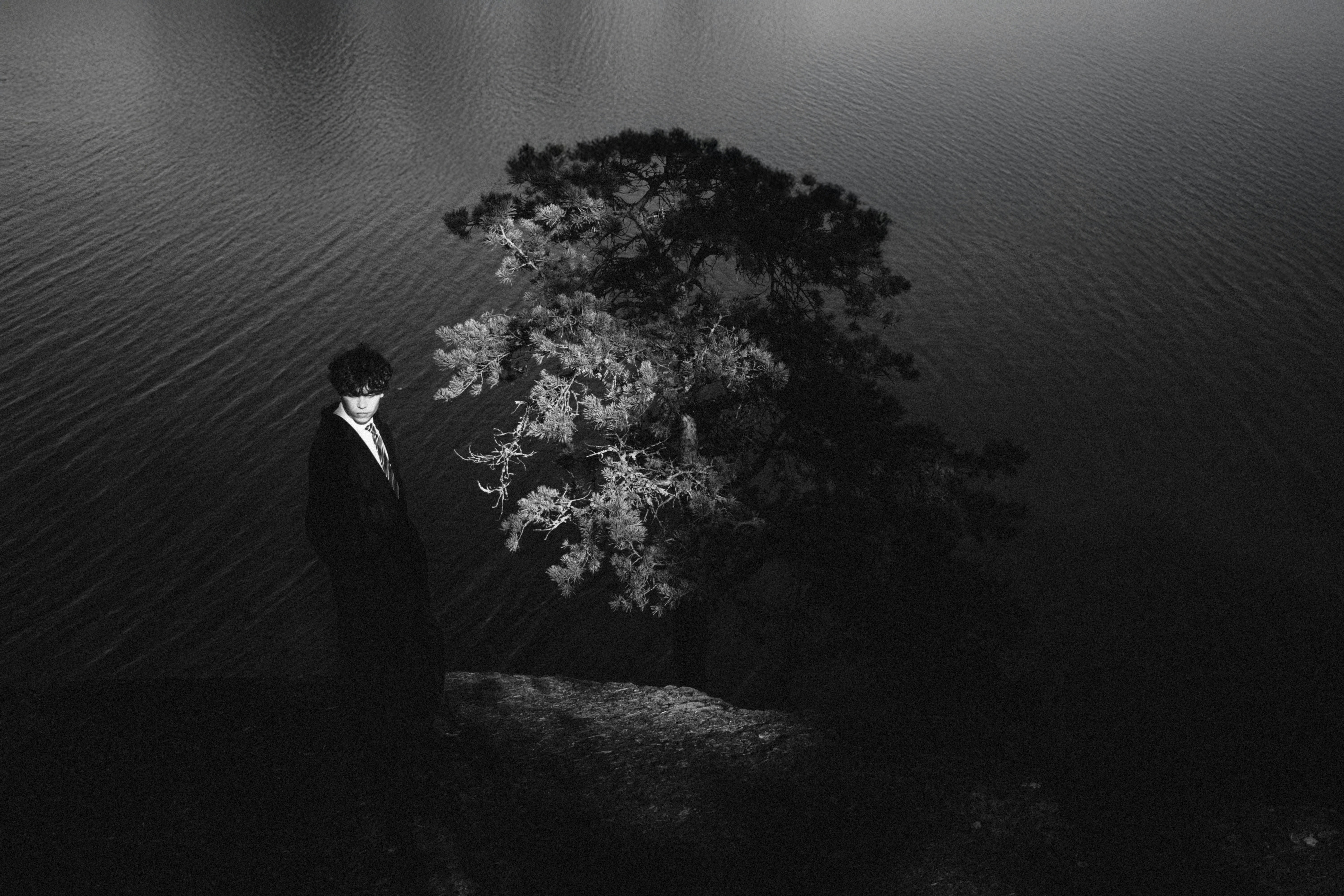 Solitary Figure at the Edge: A Quiet Harbor of Silence