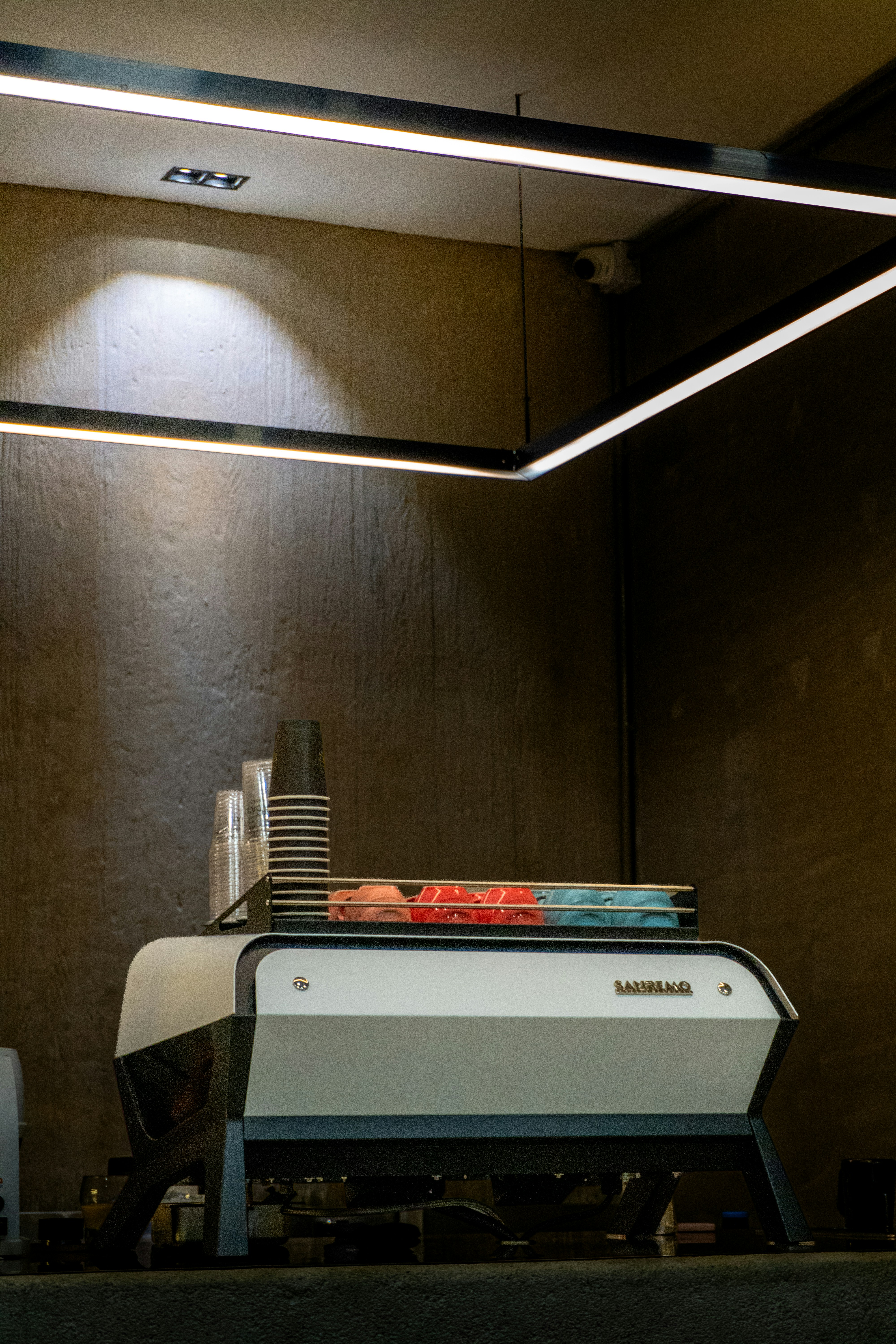 Industrial Café Espresso: A Minimalist Bar Surfaces in Dim Lighting
