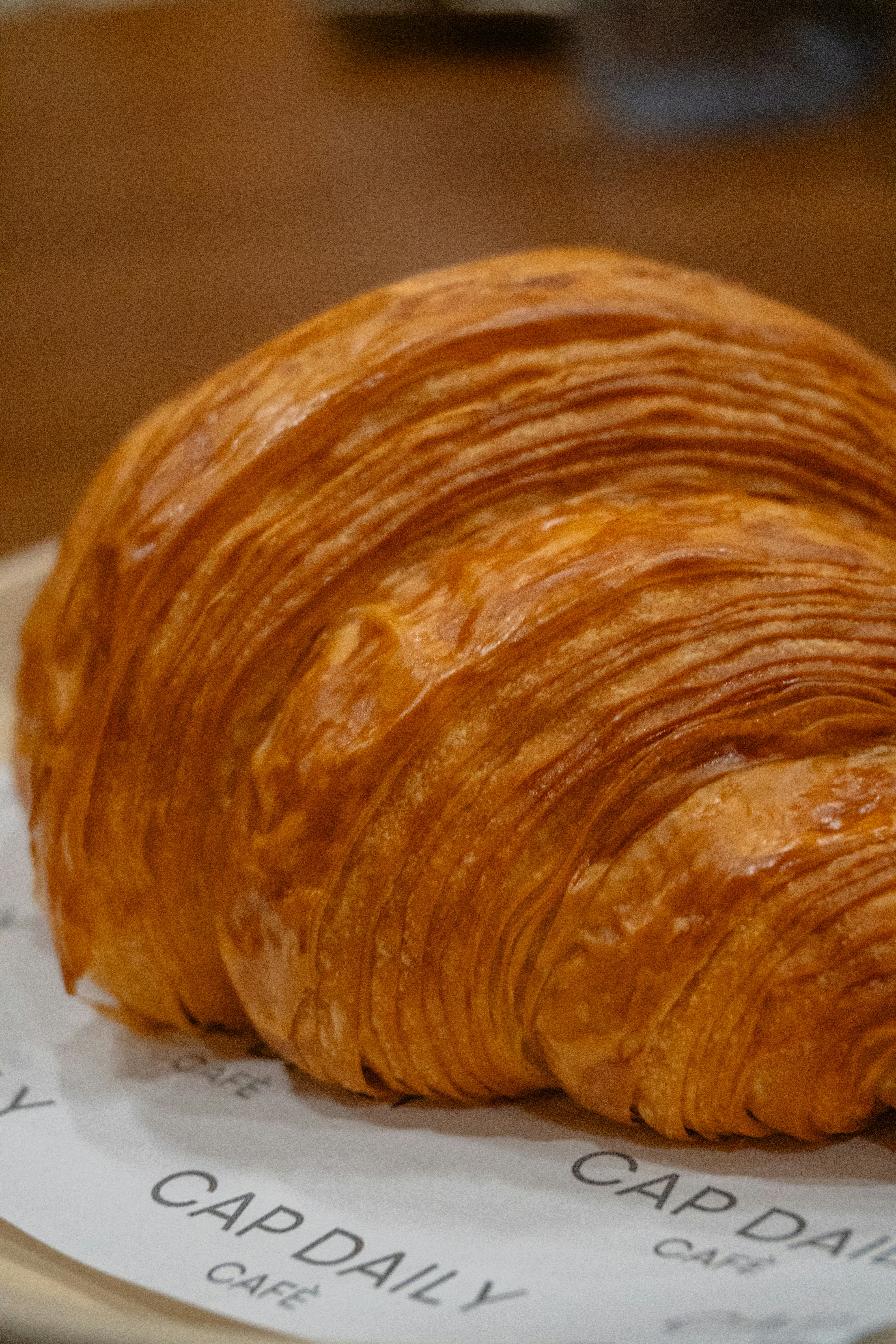 Golden Arc: A Croissant Crowned by Crinkled Layers