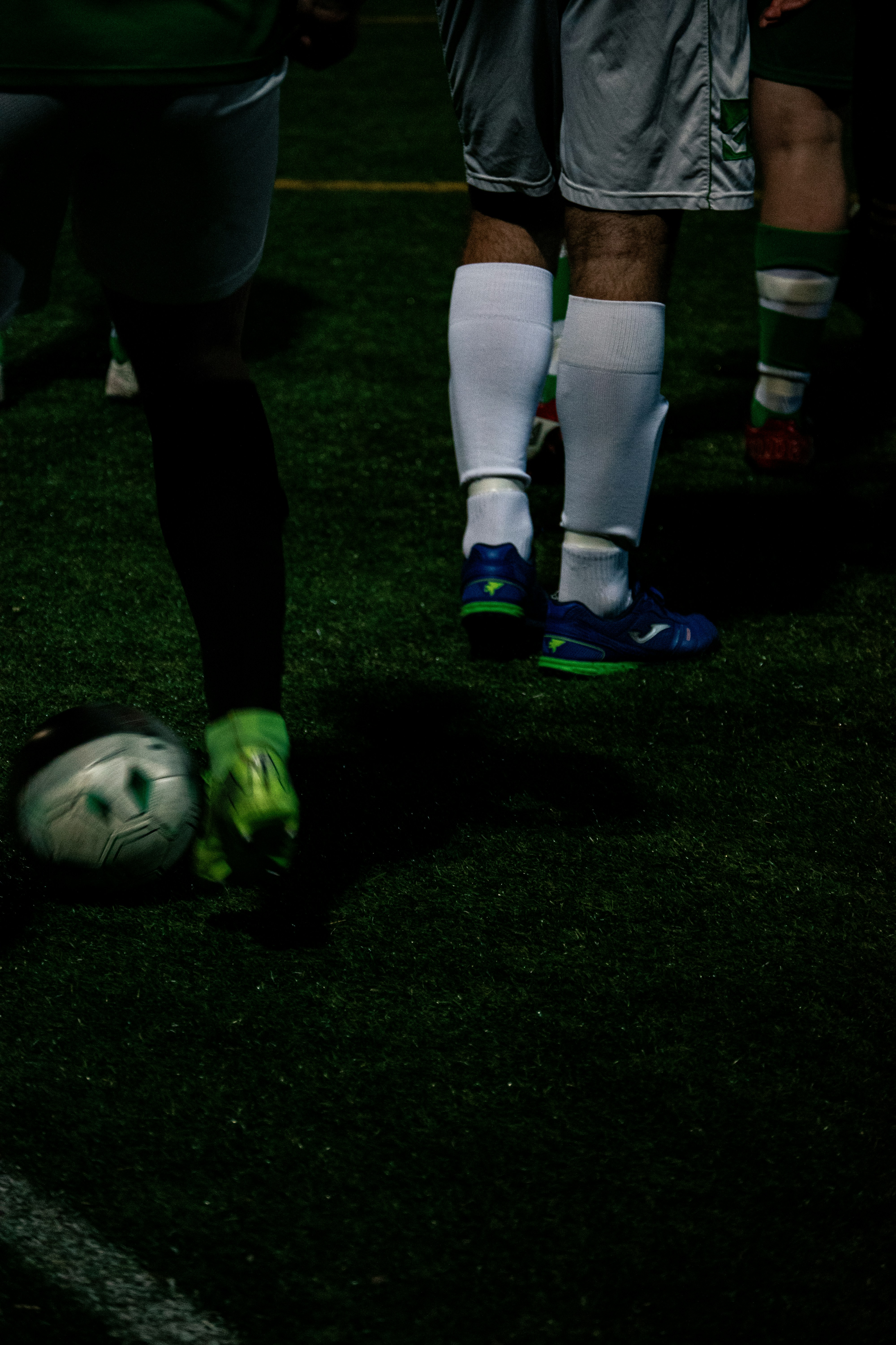 Midfield Convergence: Boots and Ball in a Night-Friendly Scrimmage