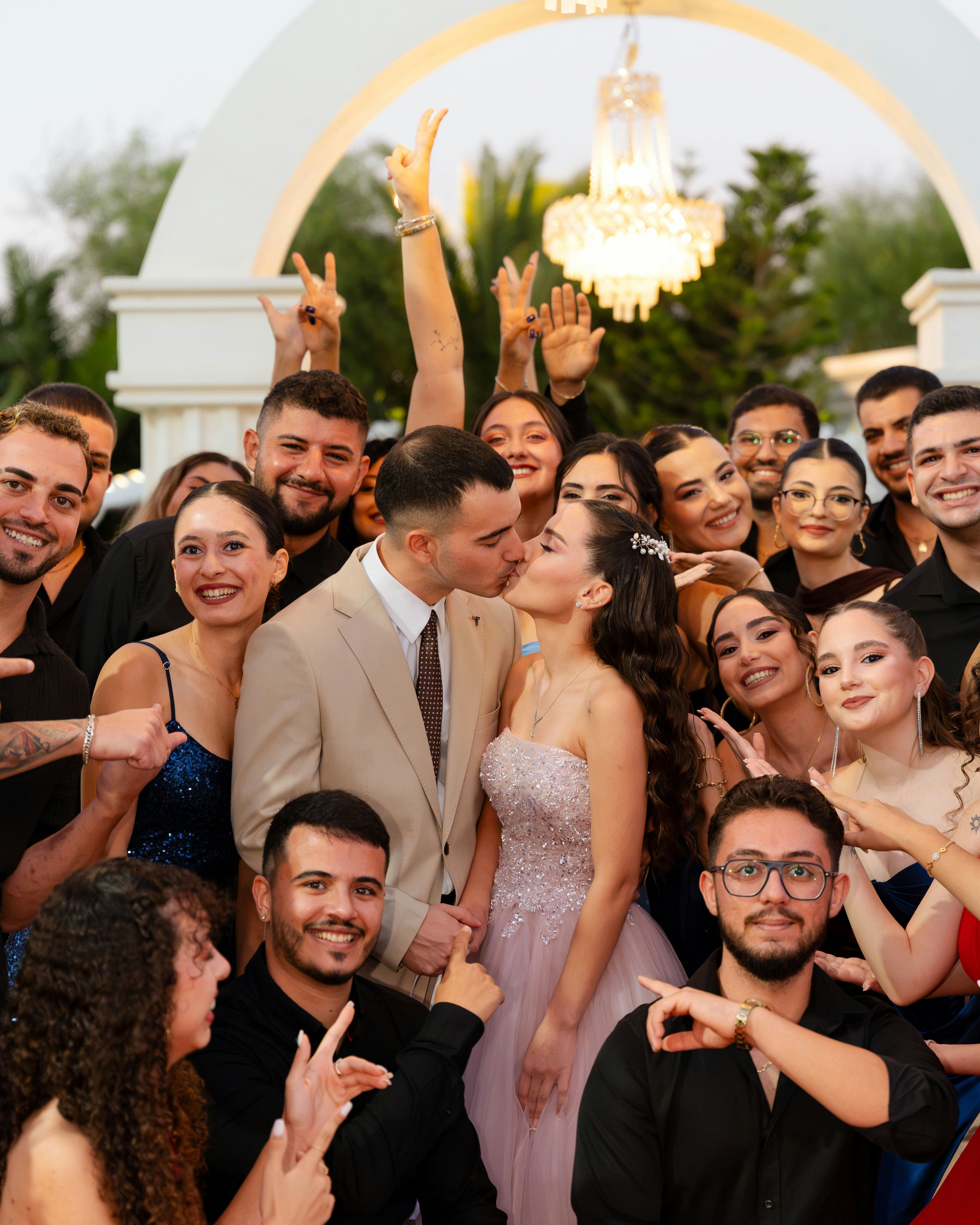 Kiss at the Center: A Wedding Party Bonded in Celebration