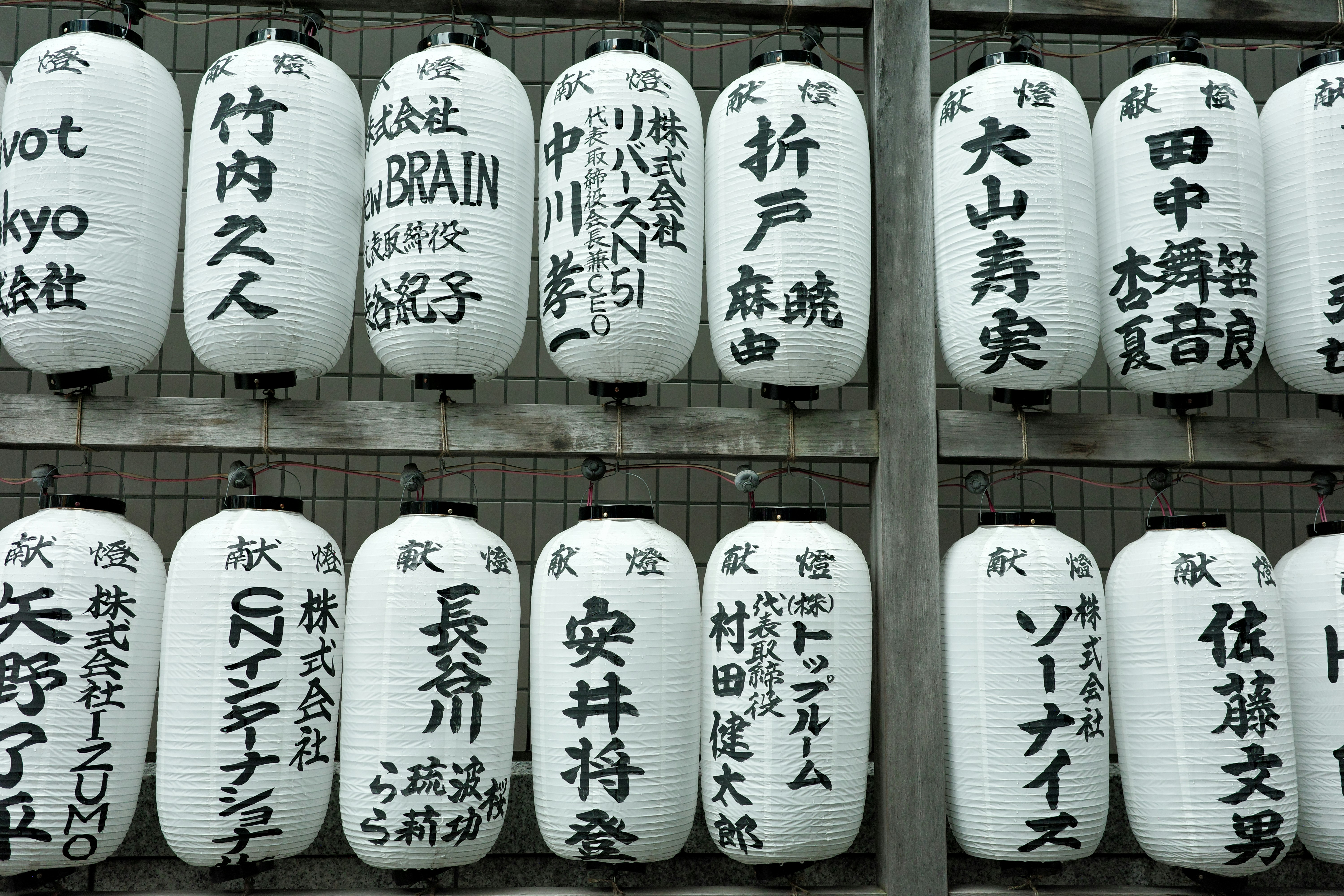 Lantern Row: Japanese Paper Lamps Hanging Beneath a Timber Frame