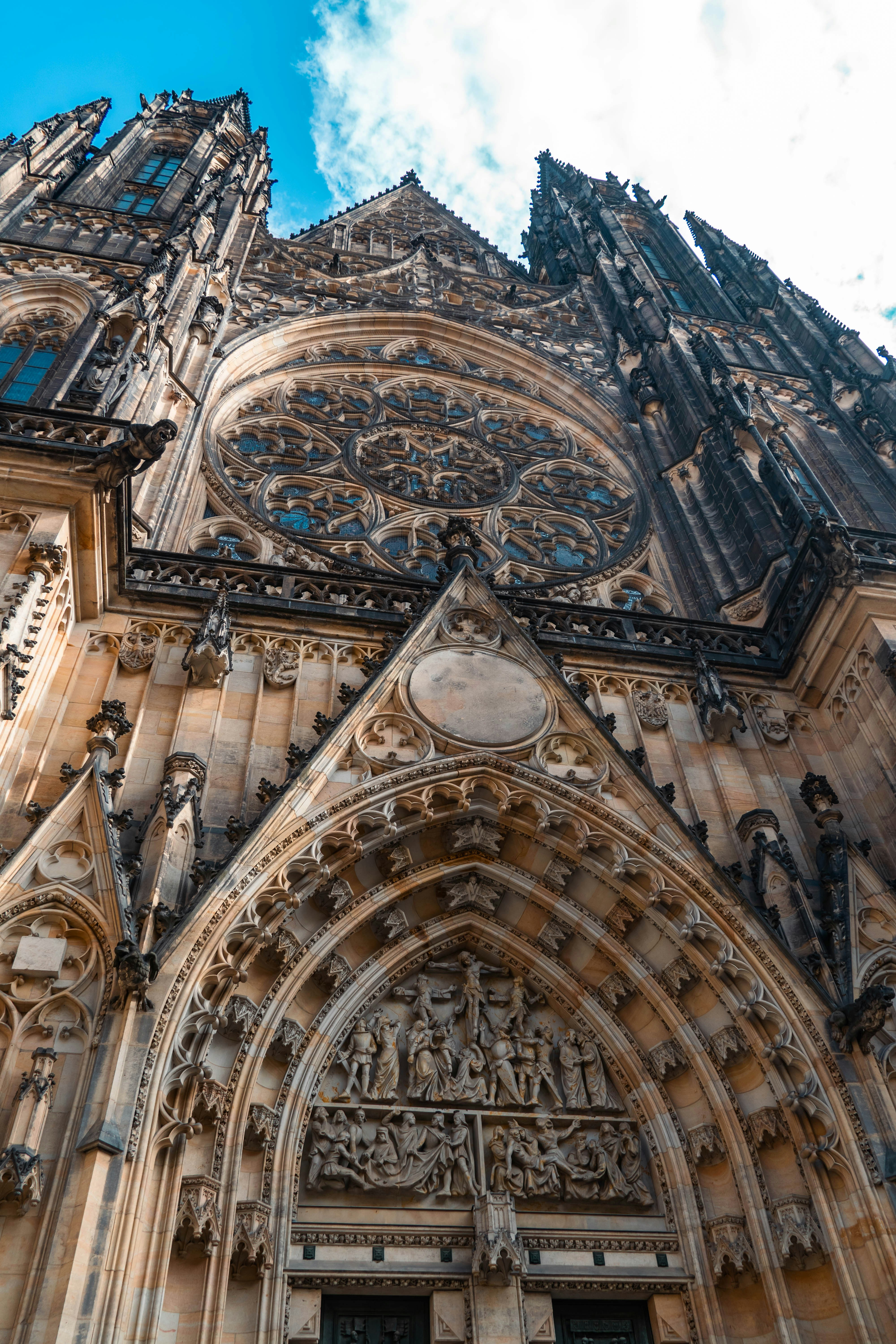 Gothic Cathedral Facade: Stone Carvings Reaching Toward a Clouded Sky