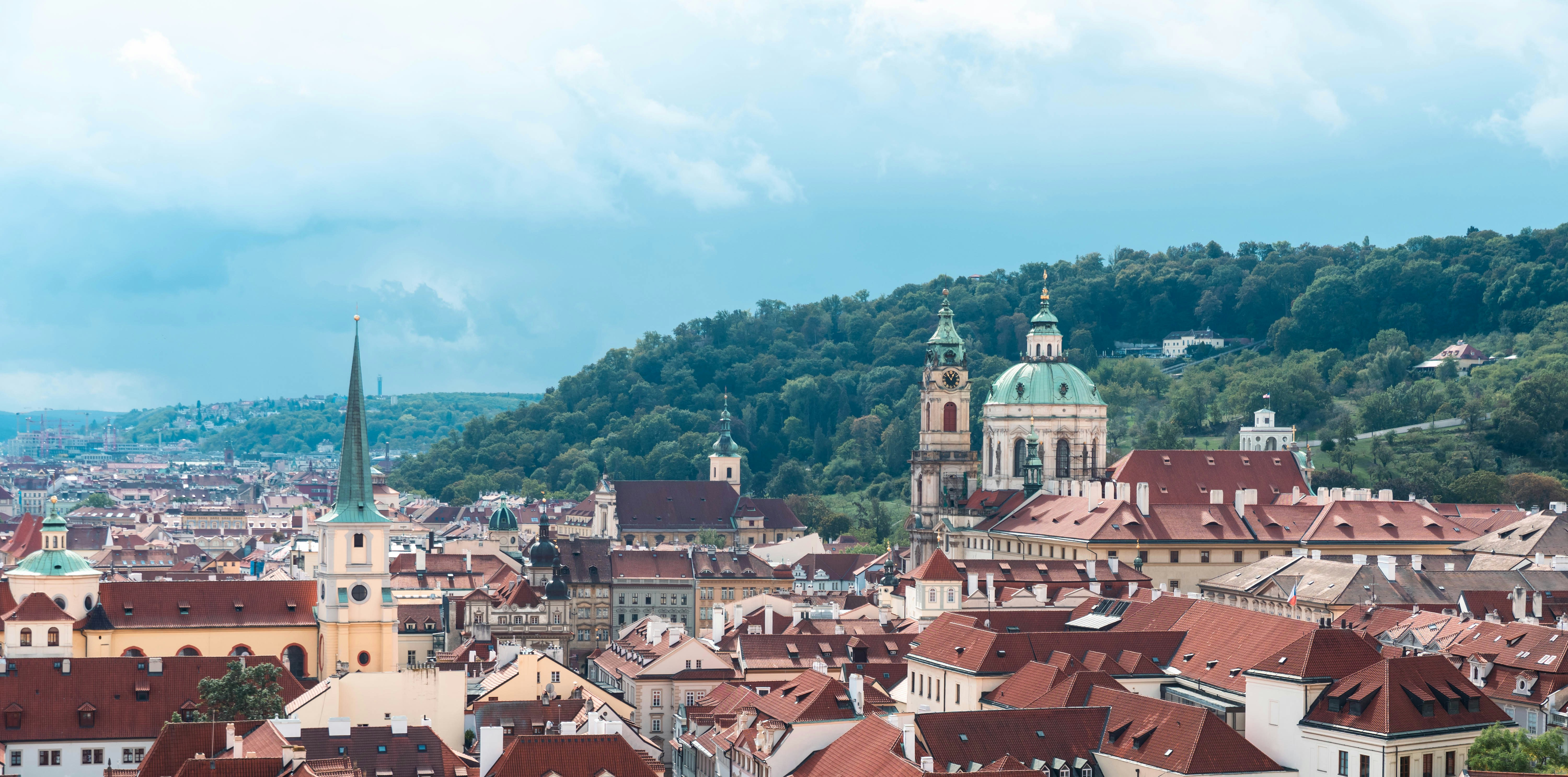 Rooftop Mosaic: A Panoramic Prague-Style Cityscape from the Hills