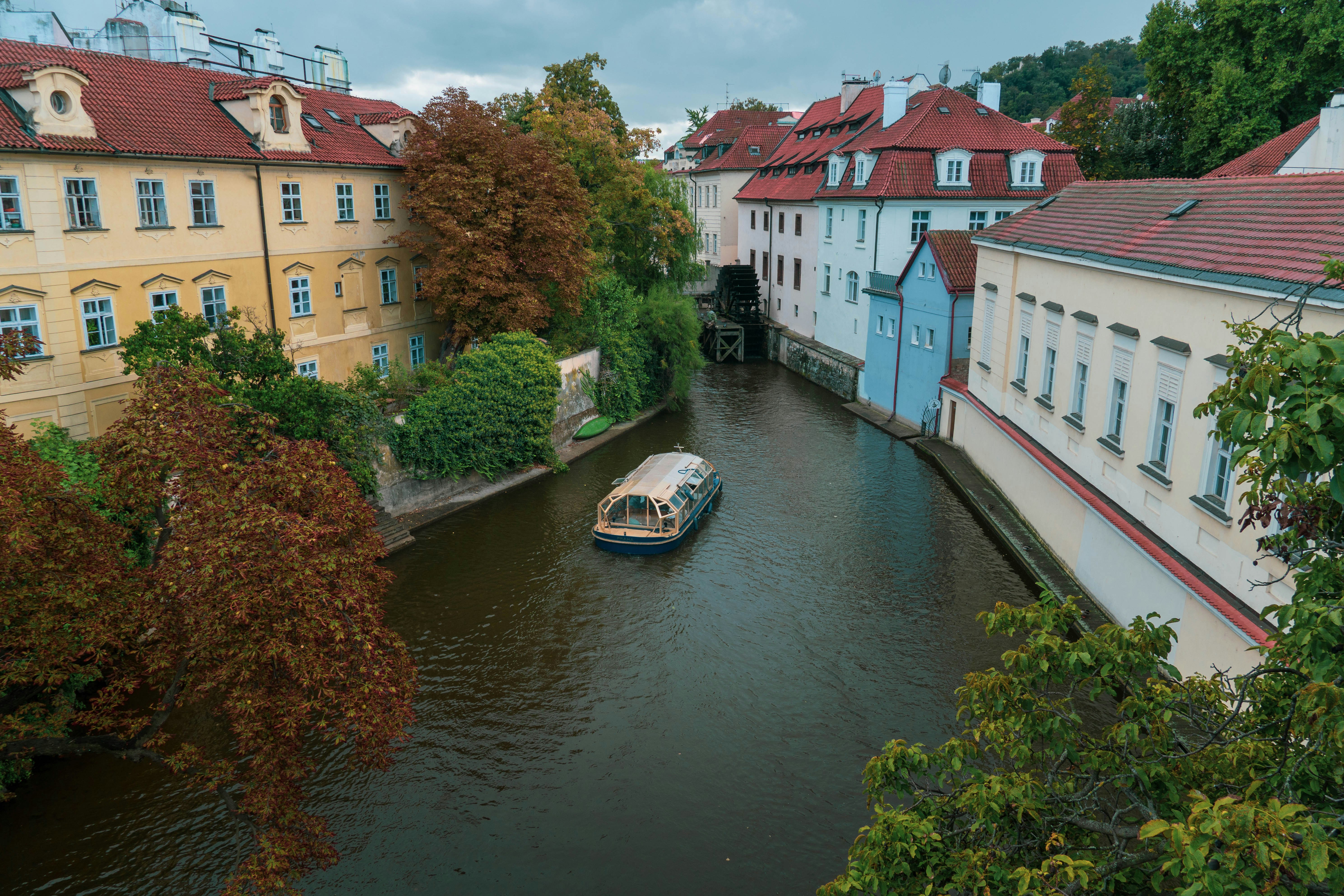 Canal Boat Meander Through Colored Riverside Galleries