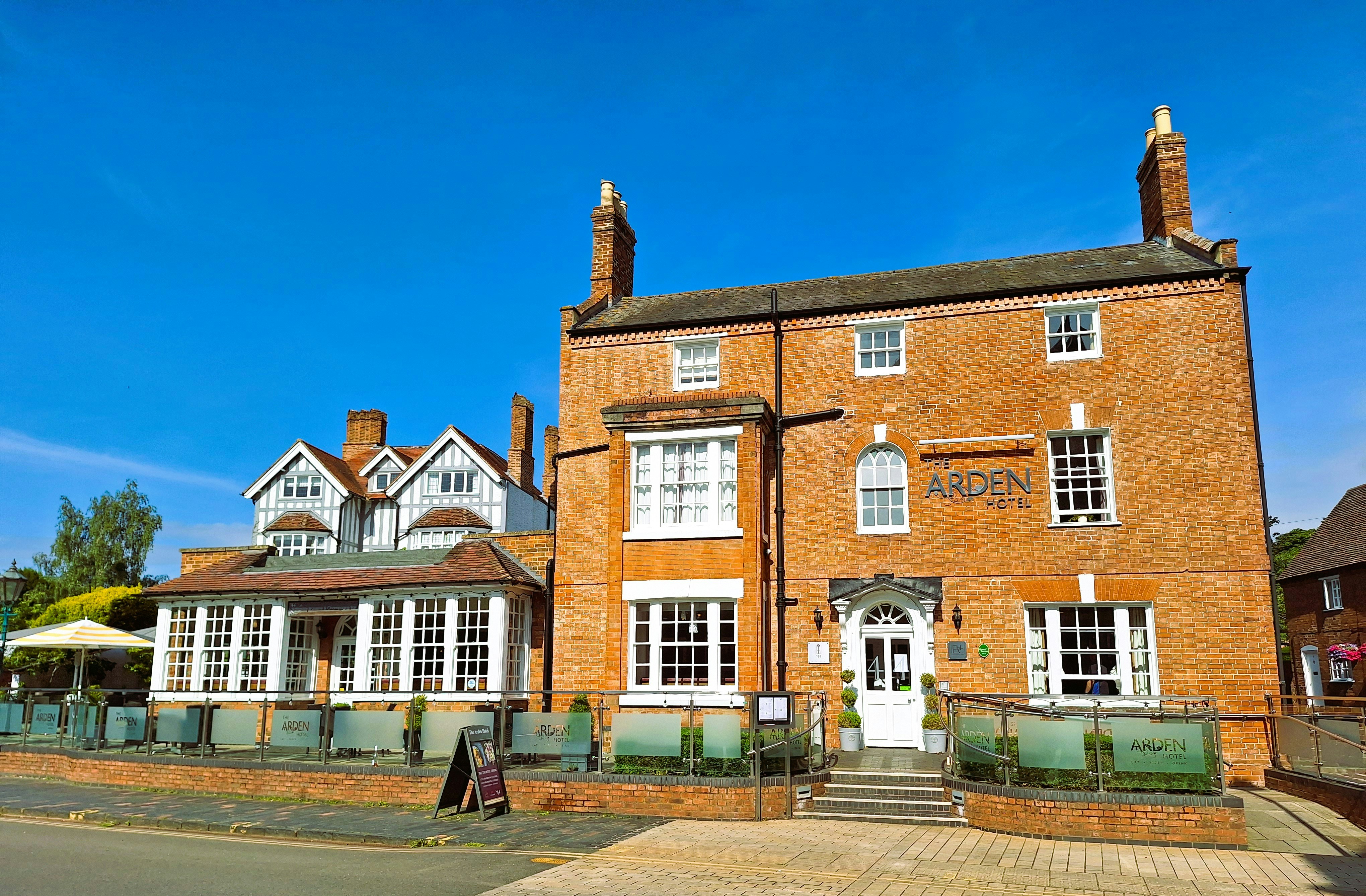 Brick Boutique: A Corner of Town with an Inviting Pub Facade