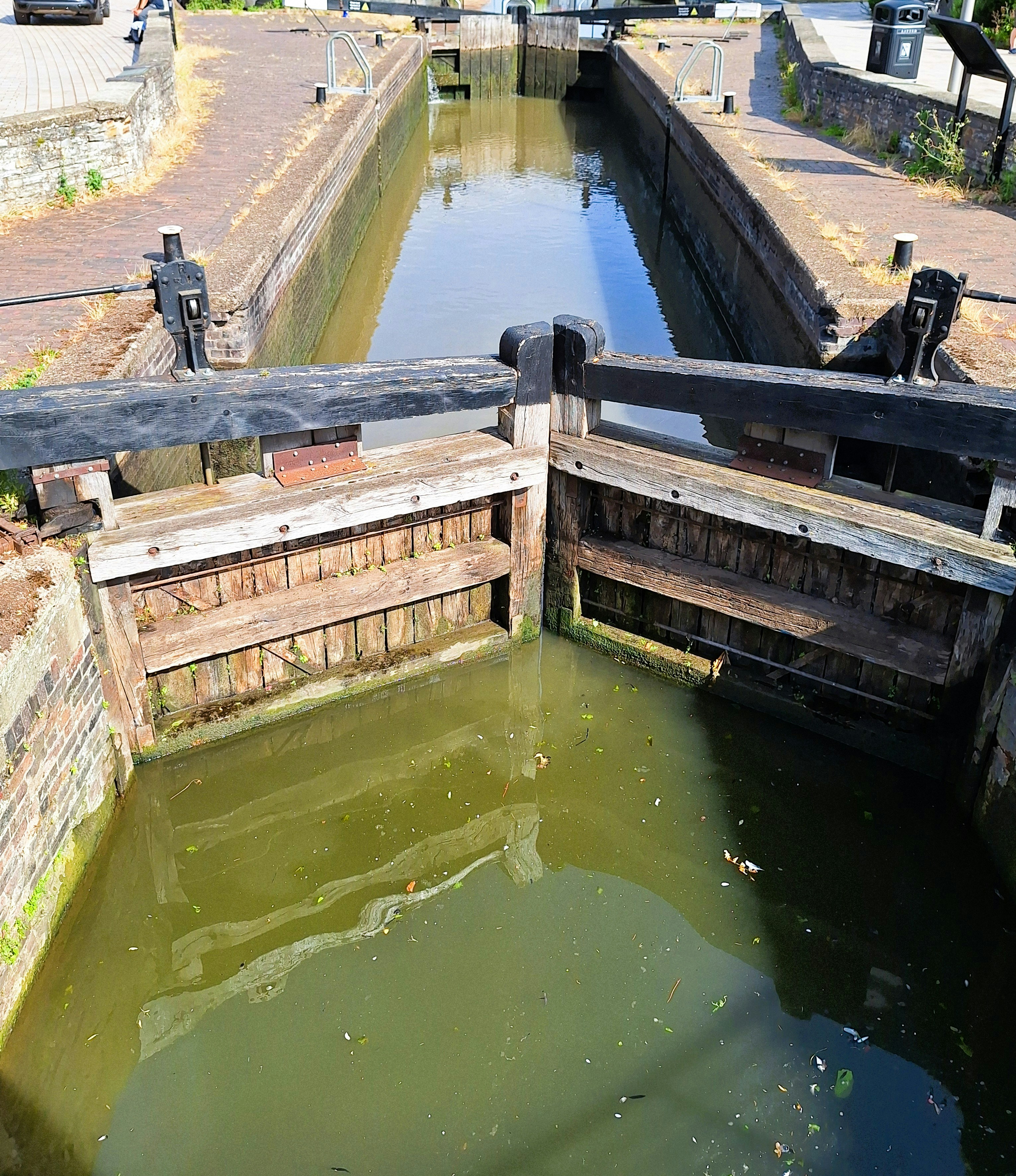 Waterway Lock with Weathered Wood and Reflections