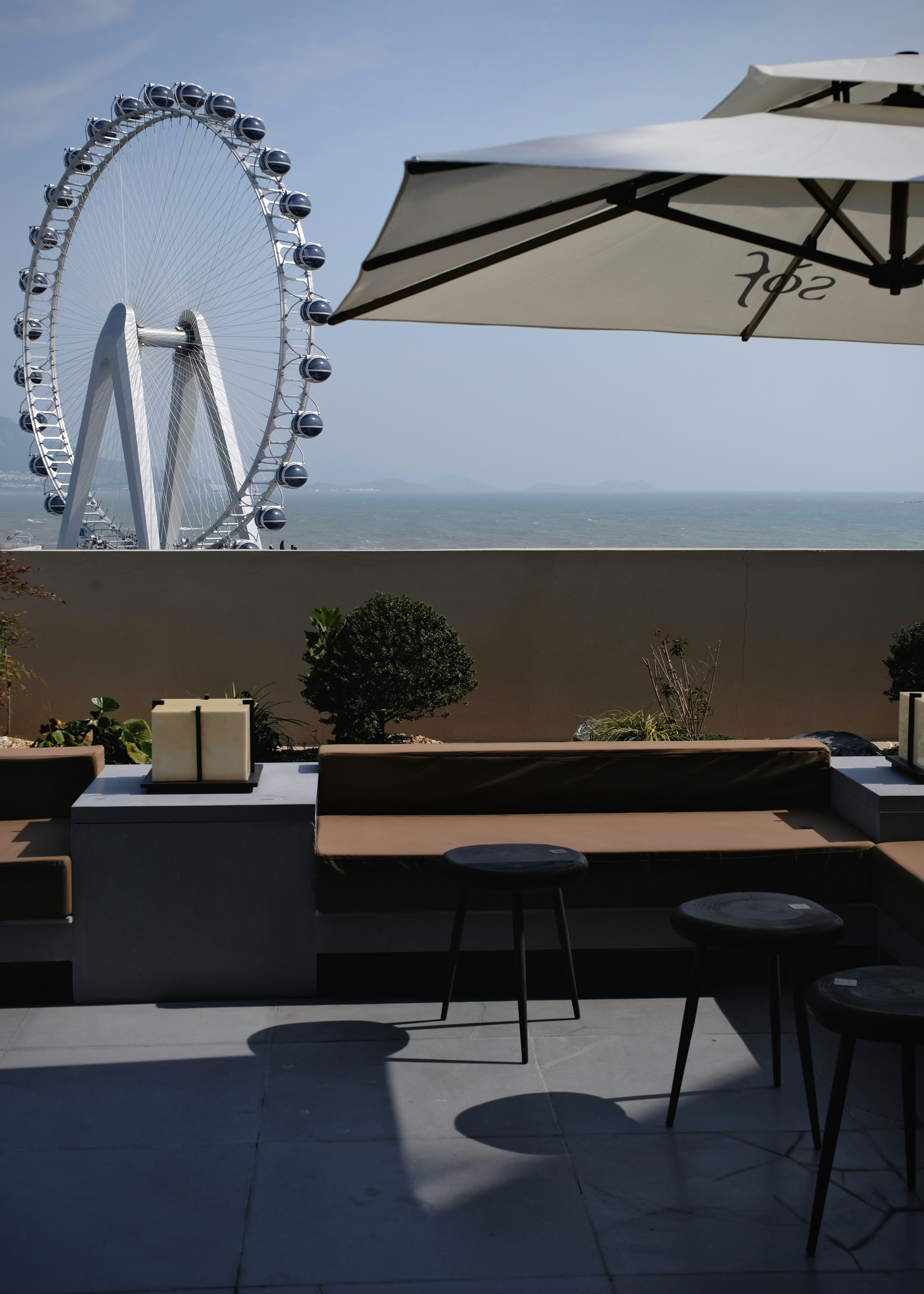 Rooftop Café Overlook: Ferris Wheel and Sea Breeze