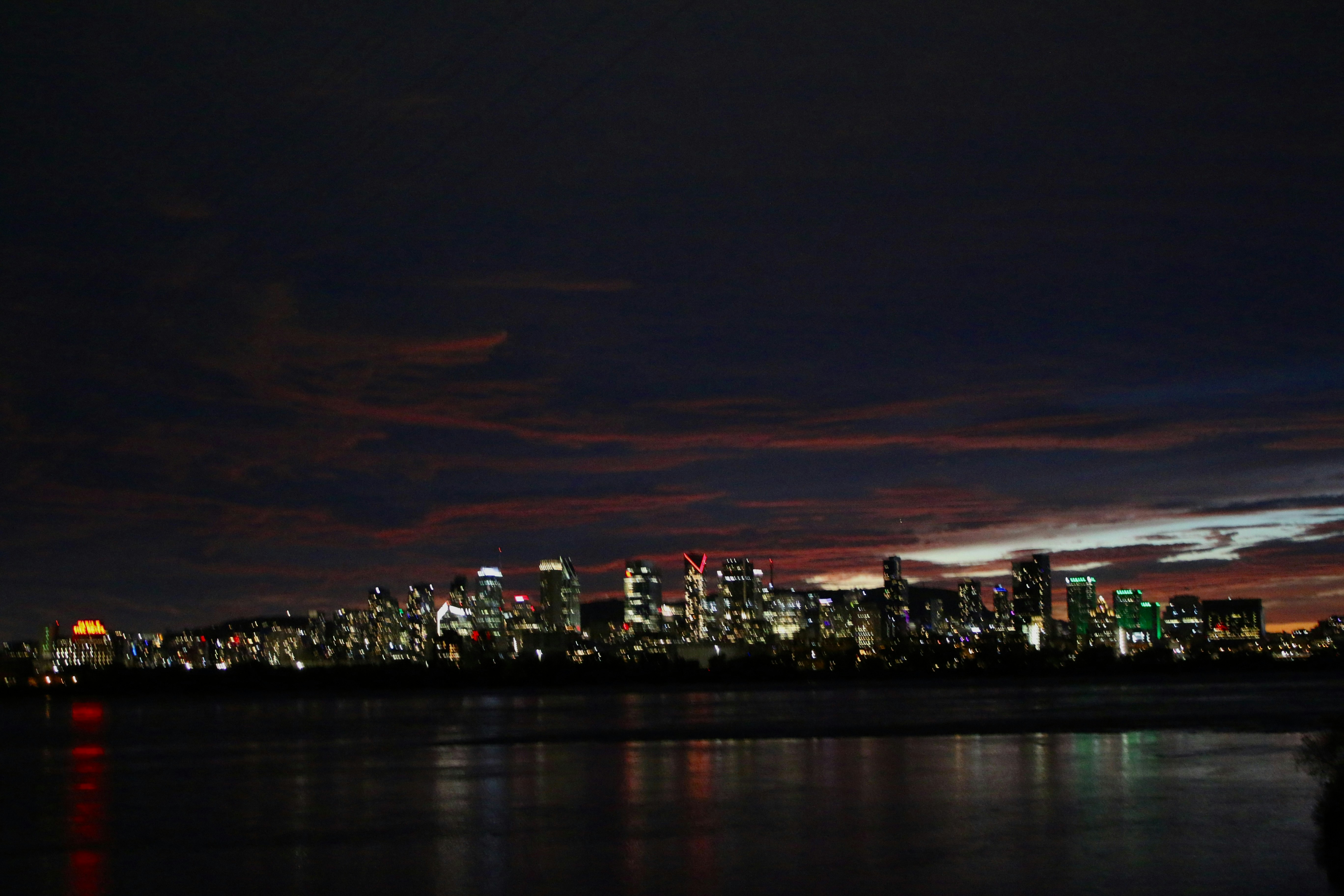 Midnight Skyline with Reflective River