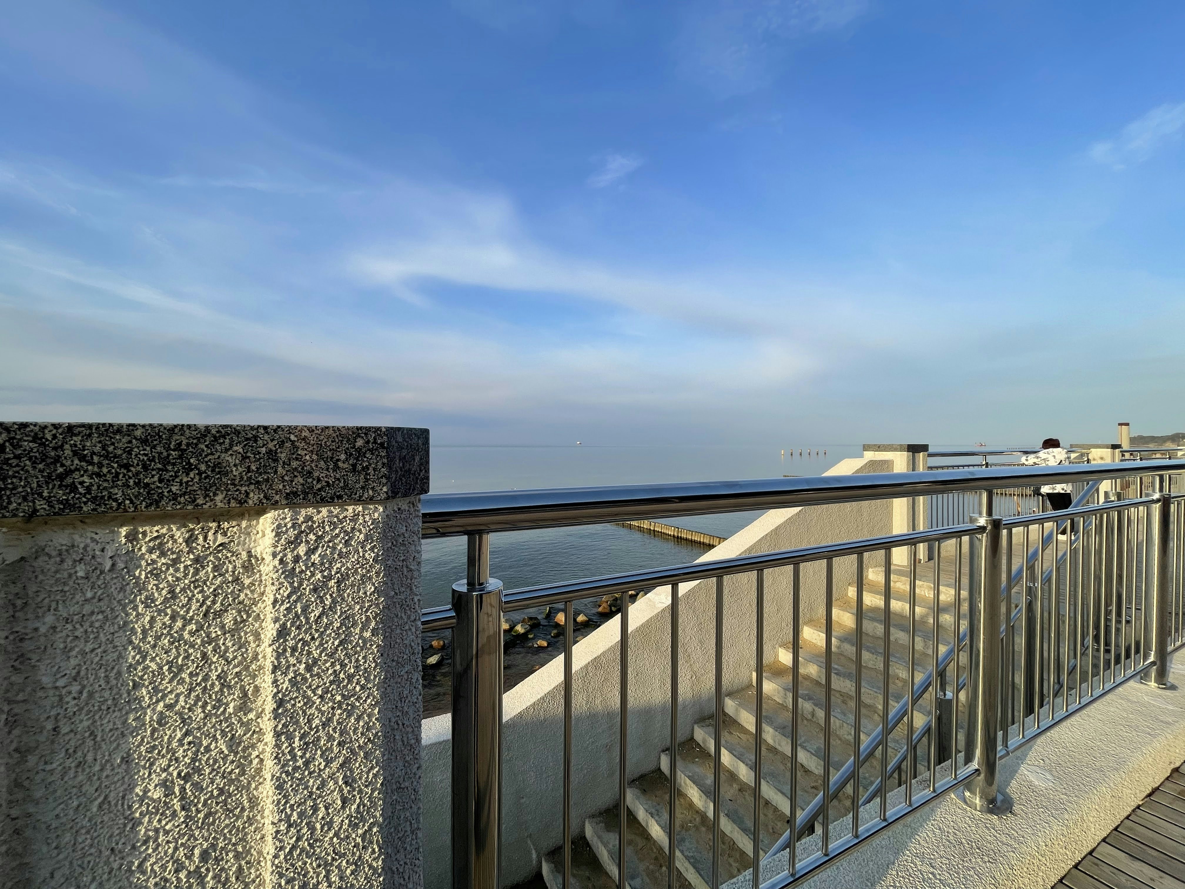 Oceanfront Terrace: A Concrete Walkway Reaching Toward the Horizon