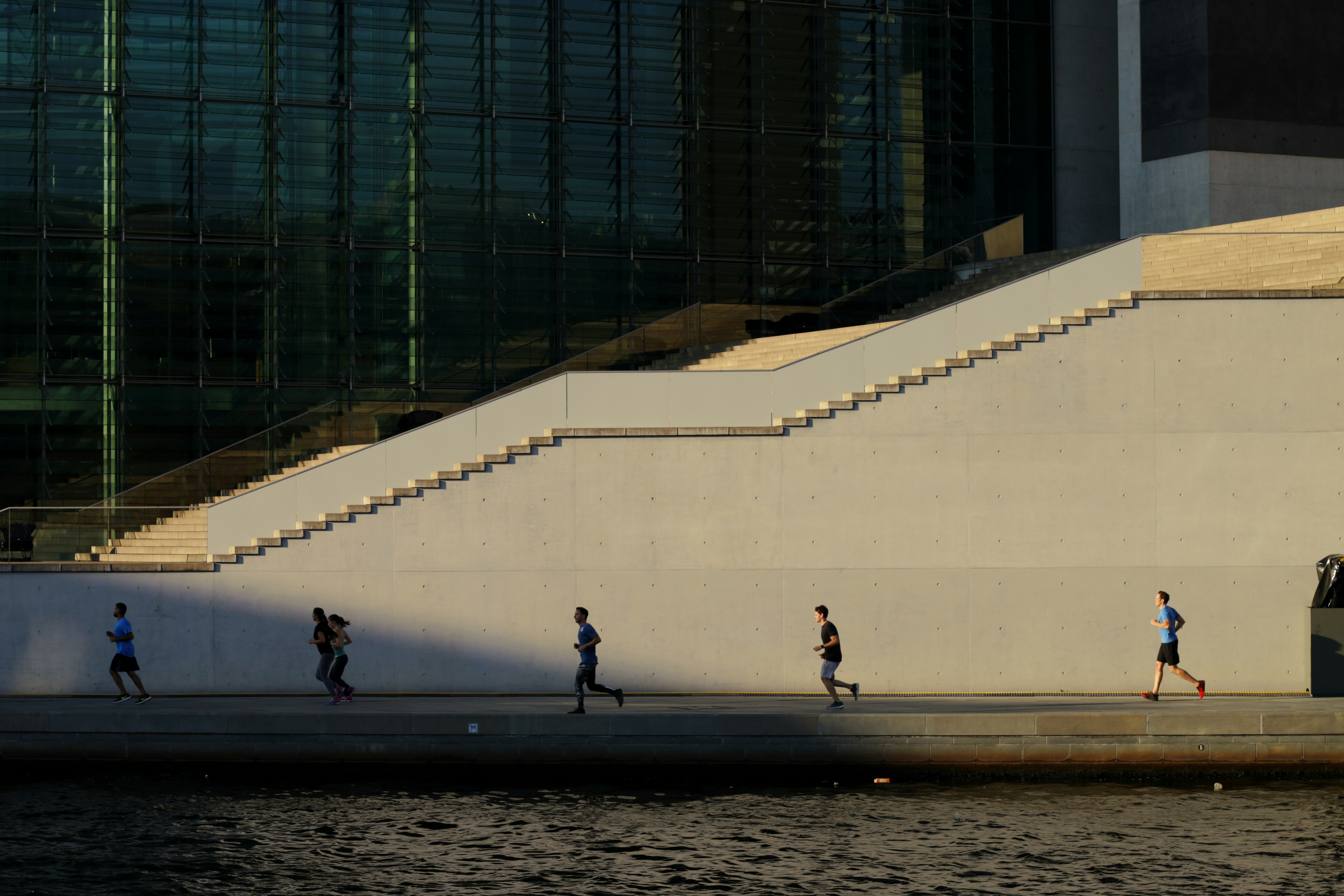 Runners Along the Riverfront: A Quiet Line Across Concrete Steps