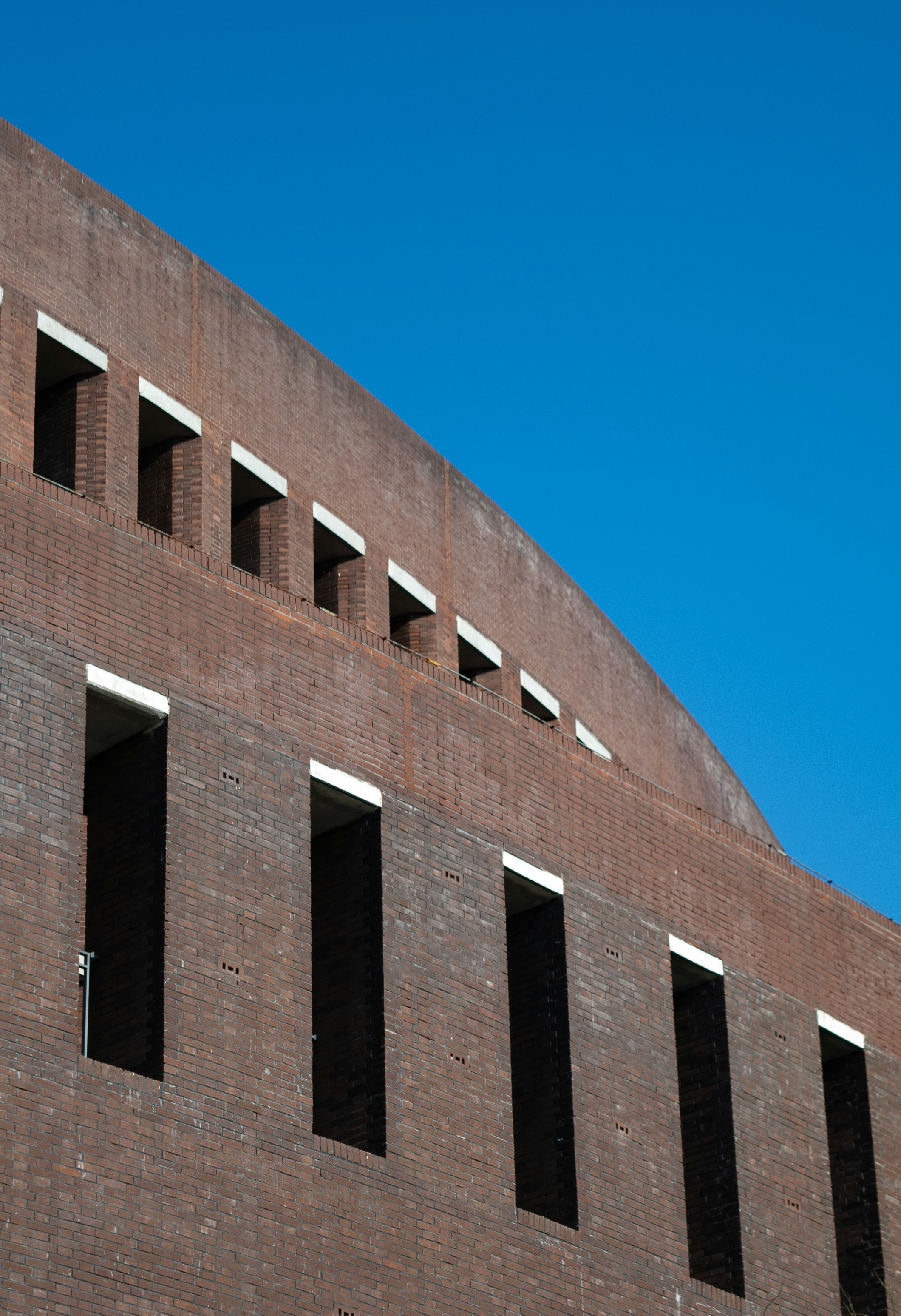Brick Facade Under a Bright Blue Sky