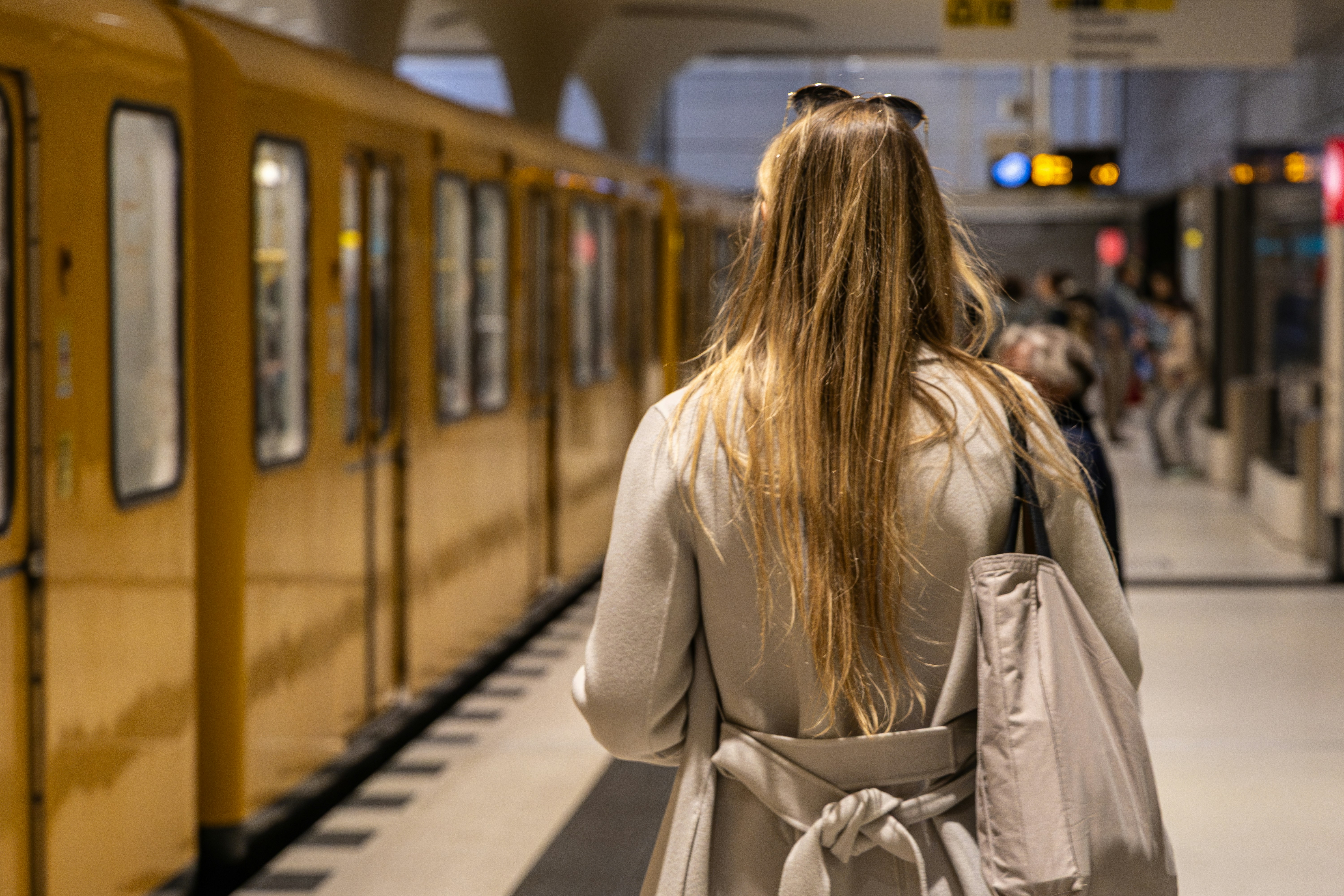 Commuter in a Yellow-Trim Subway: Back View Through Morning Doors