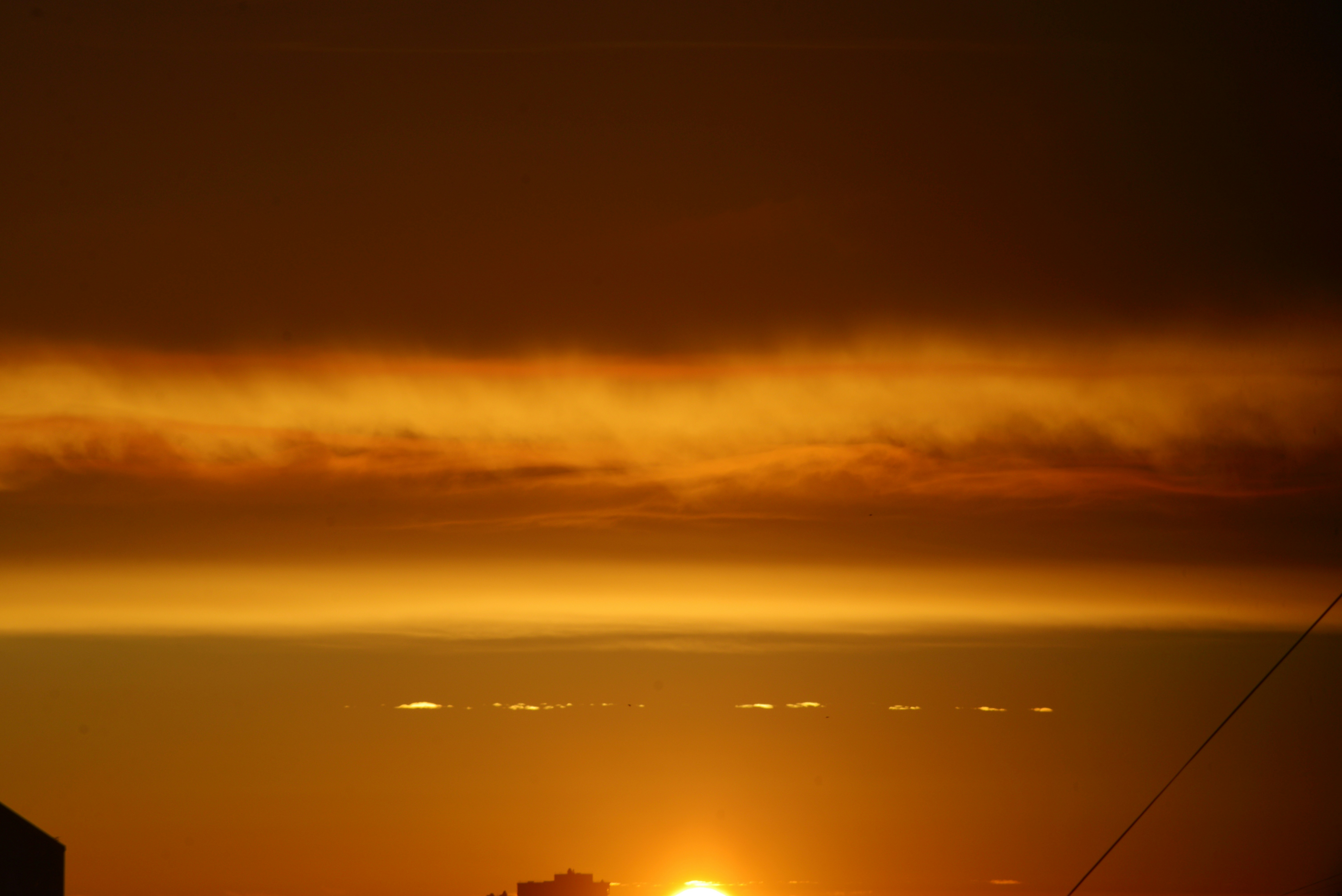 Horizon Embrace: A Low Sun Cascade into Evening Sky