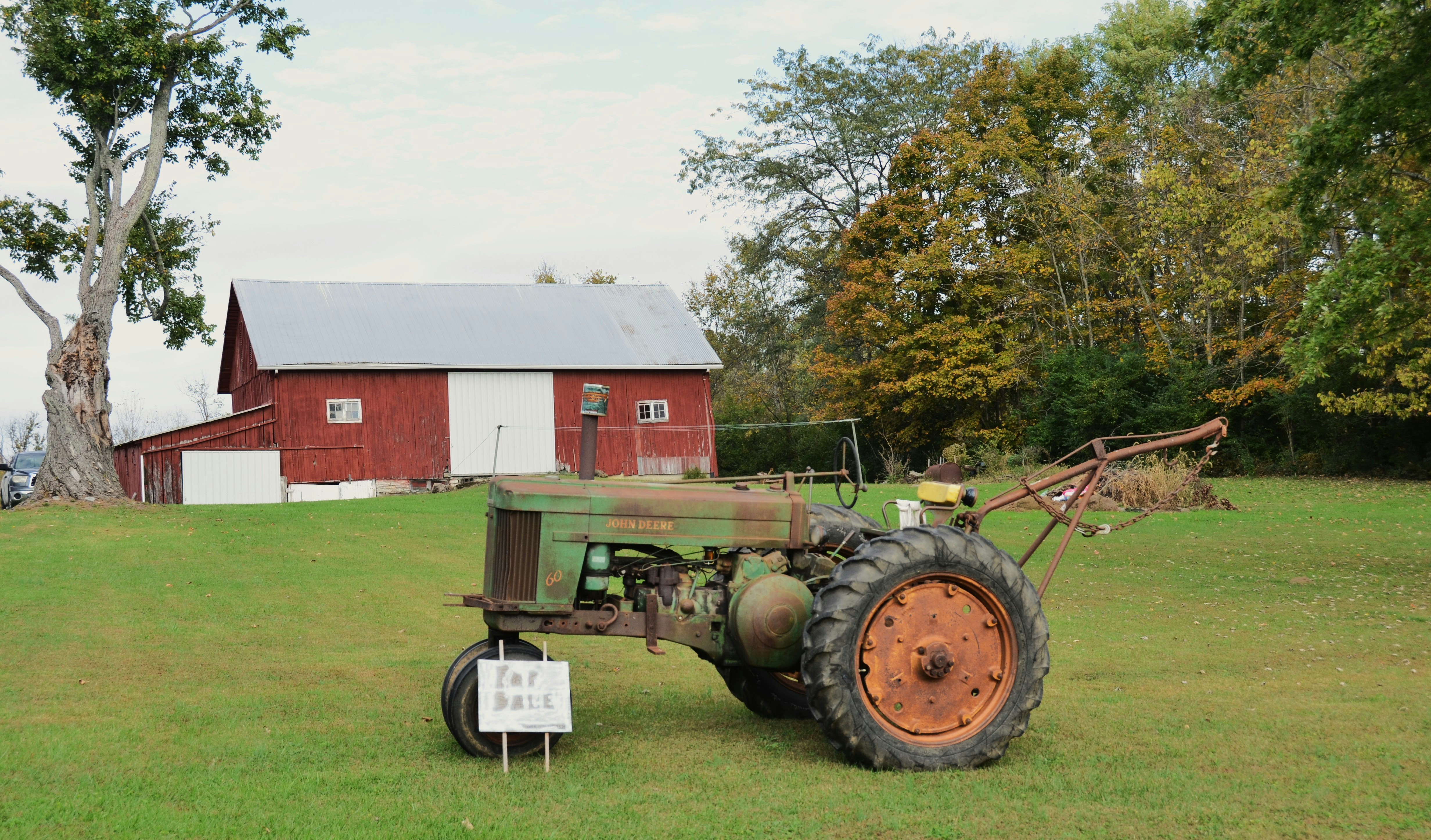 Rusty Tractor on a Quiet Farm Green