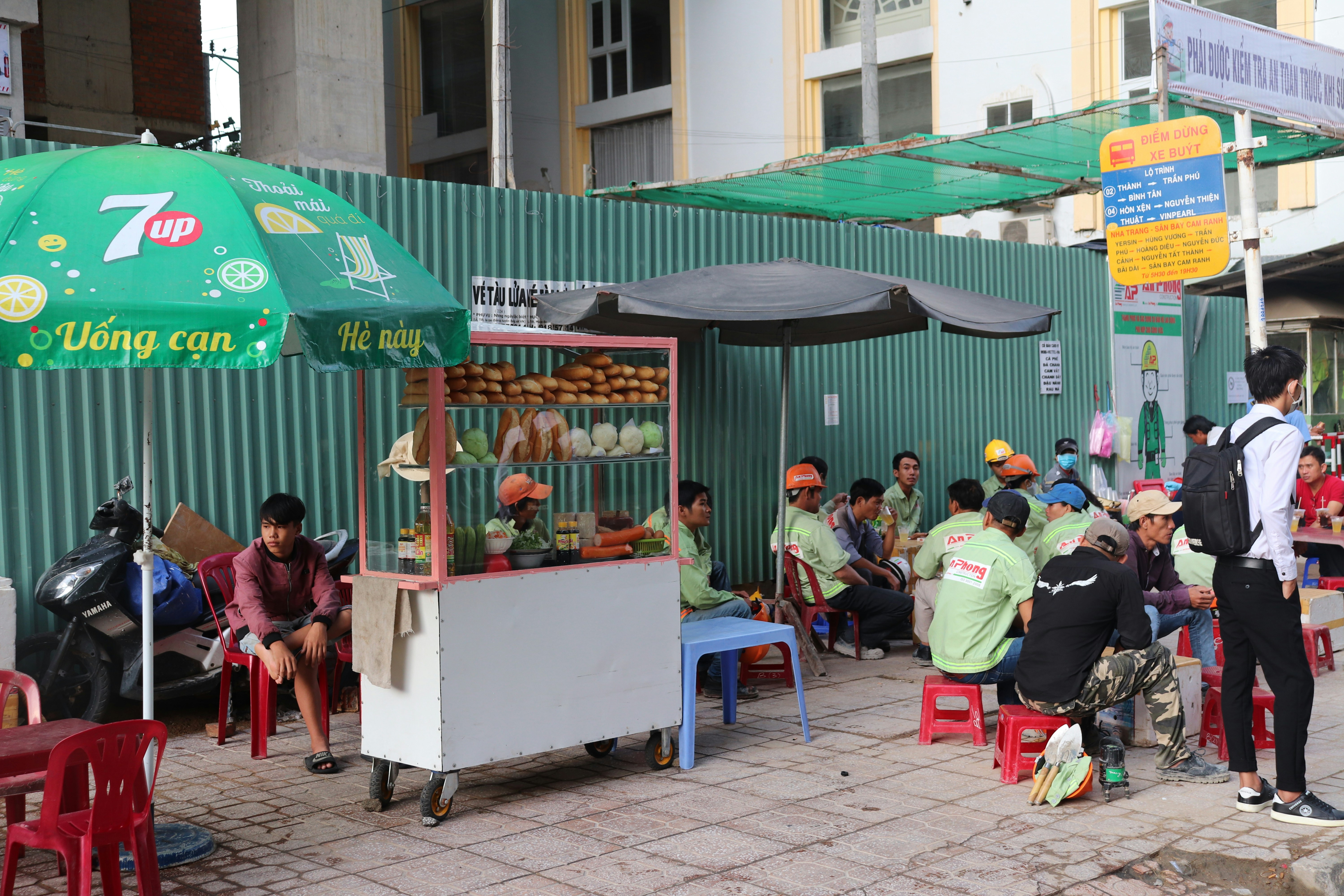 Market Stand at Dusk: Street Vendors and Community Seating