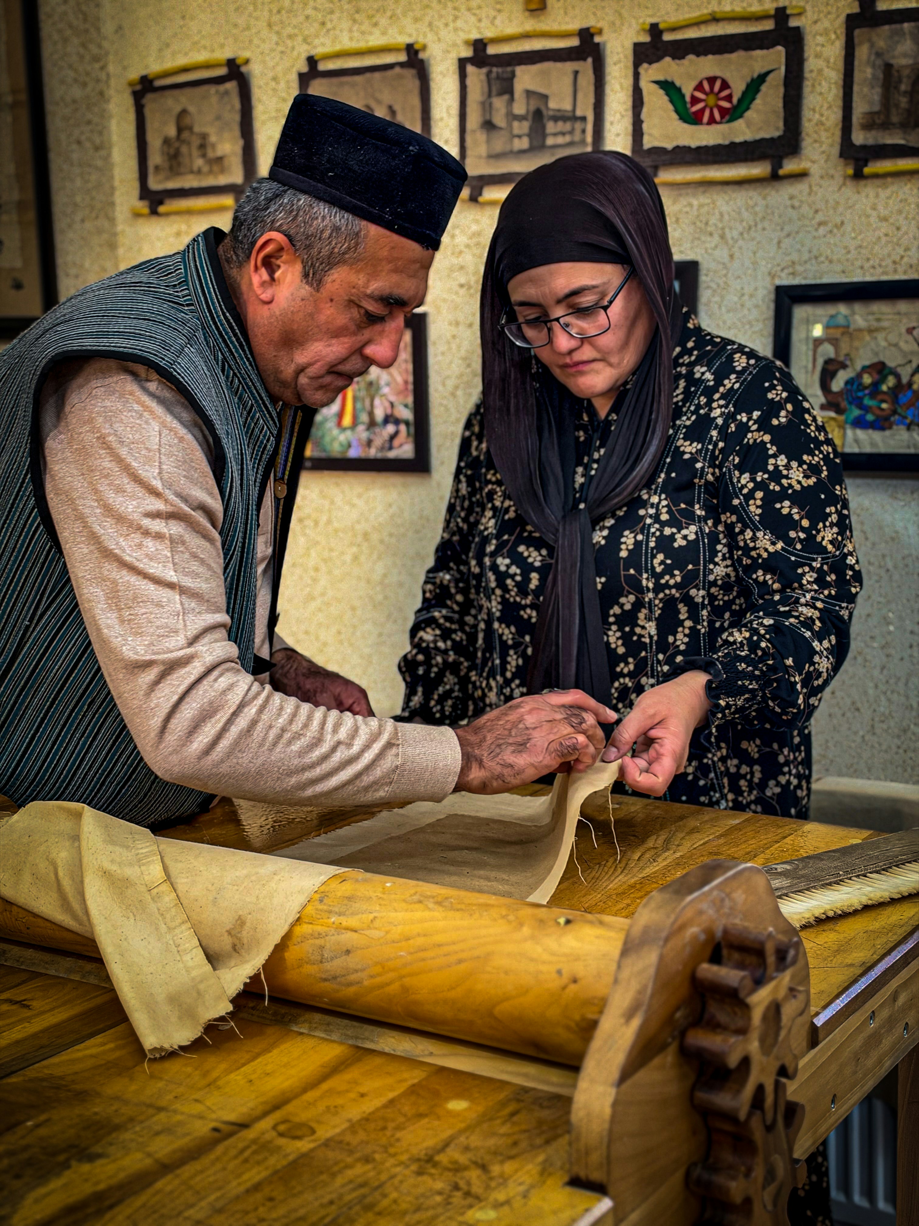 Weaving Wisdom: Hands Steady Over the Loom
