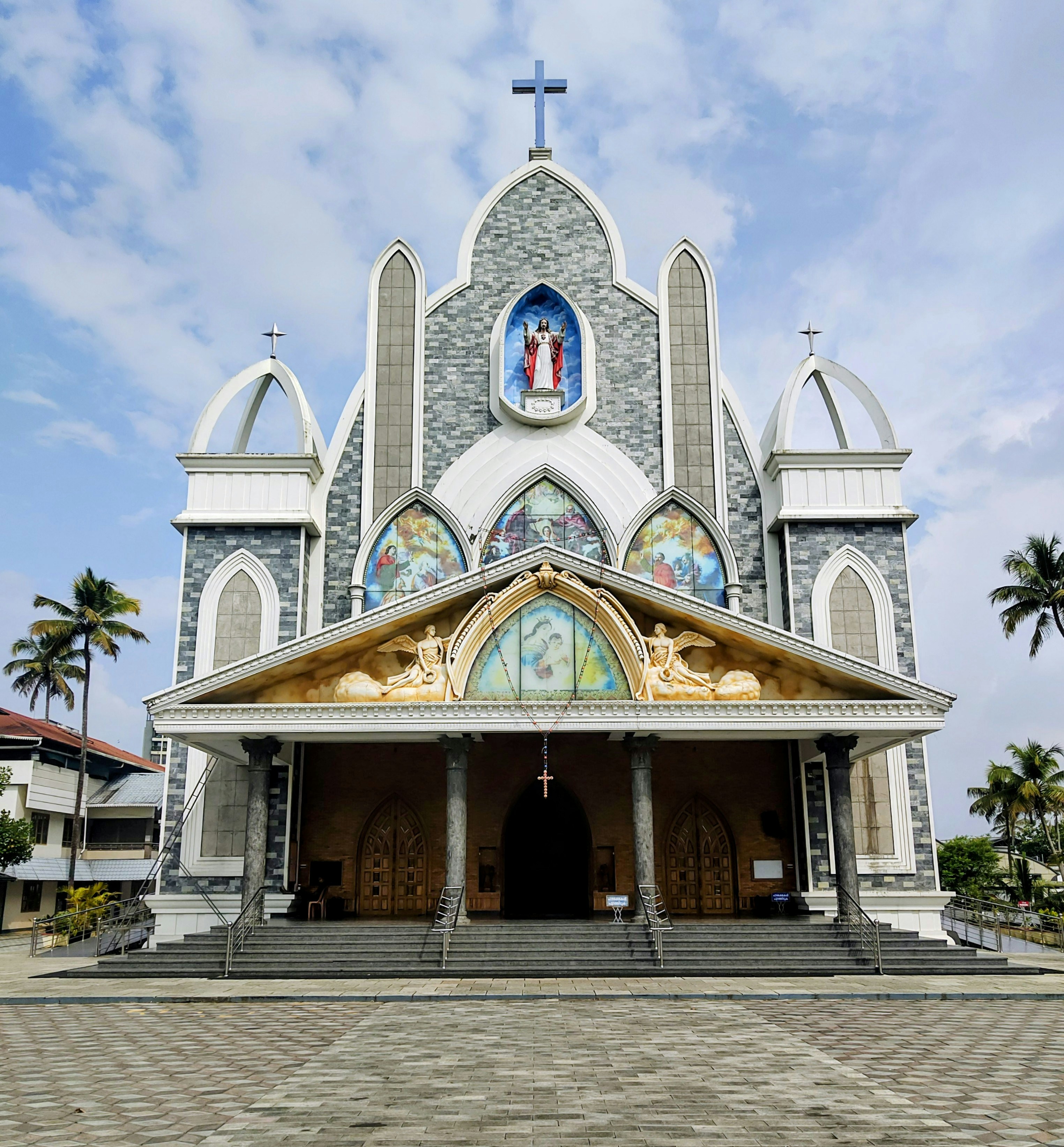Symmetrical Gothic Revival Cathedral with Painted Apse and Central Portal
