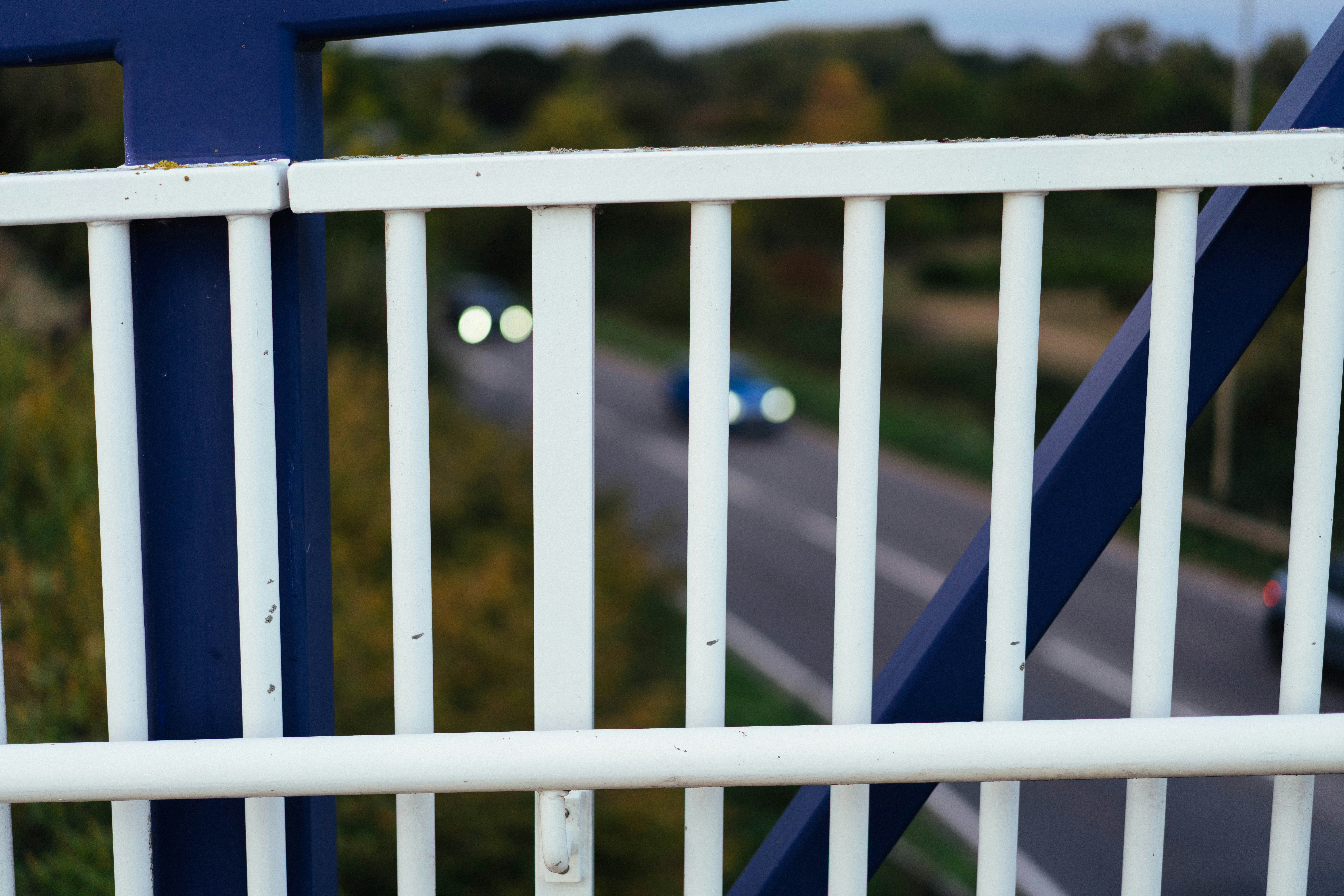 Through the Rails: A Quiet Road Sneaks by