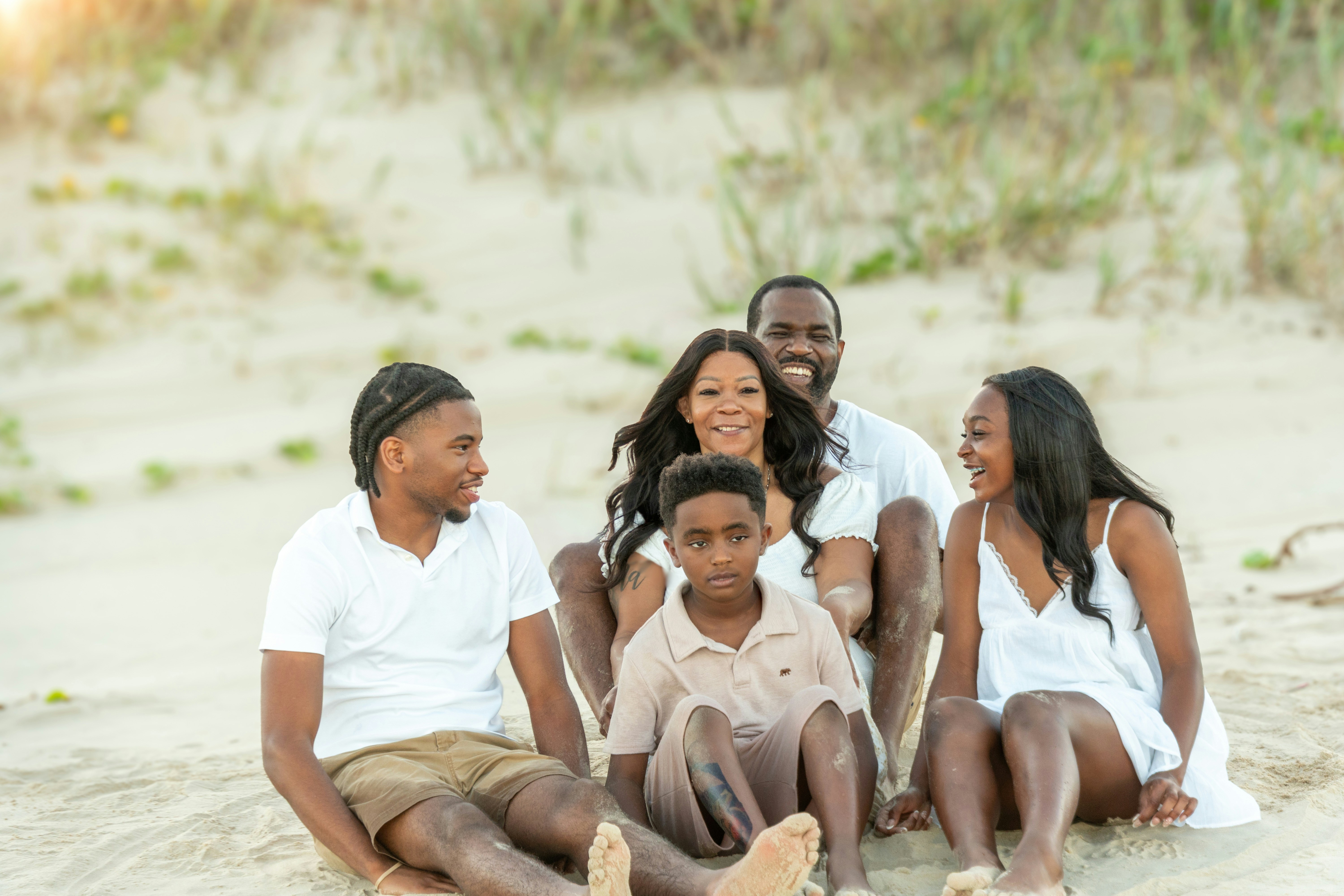 Sunlit Sand, Shared Smiles: A Joyful Family Moment by the Shore