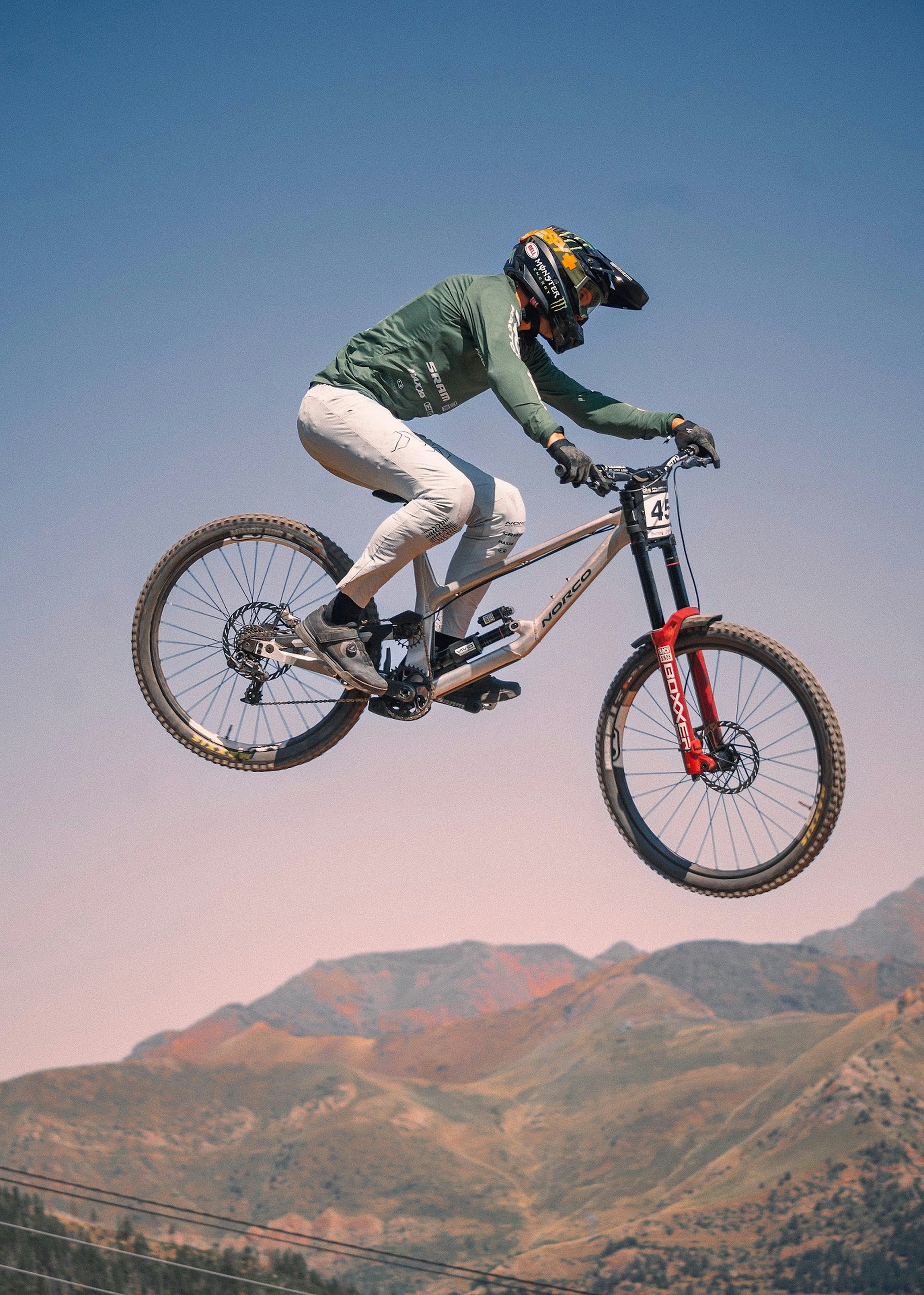 Mountain biker jumping over mountain landscape - Free Photo on Unsplash