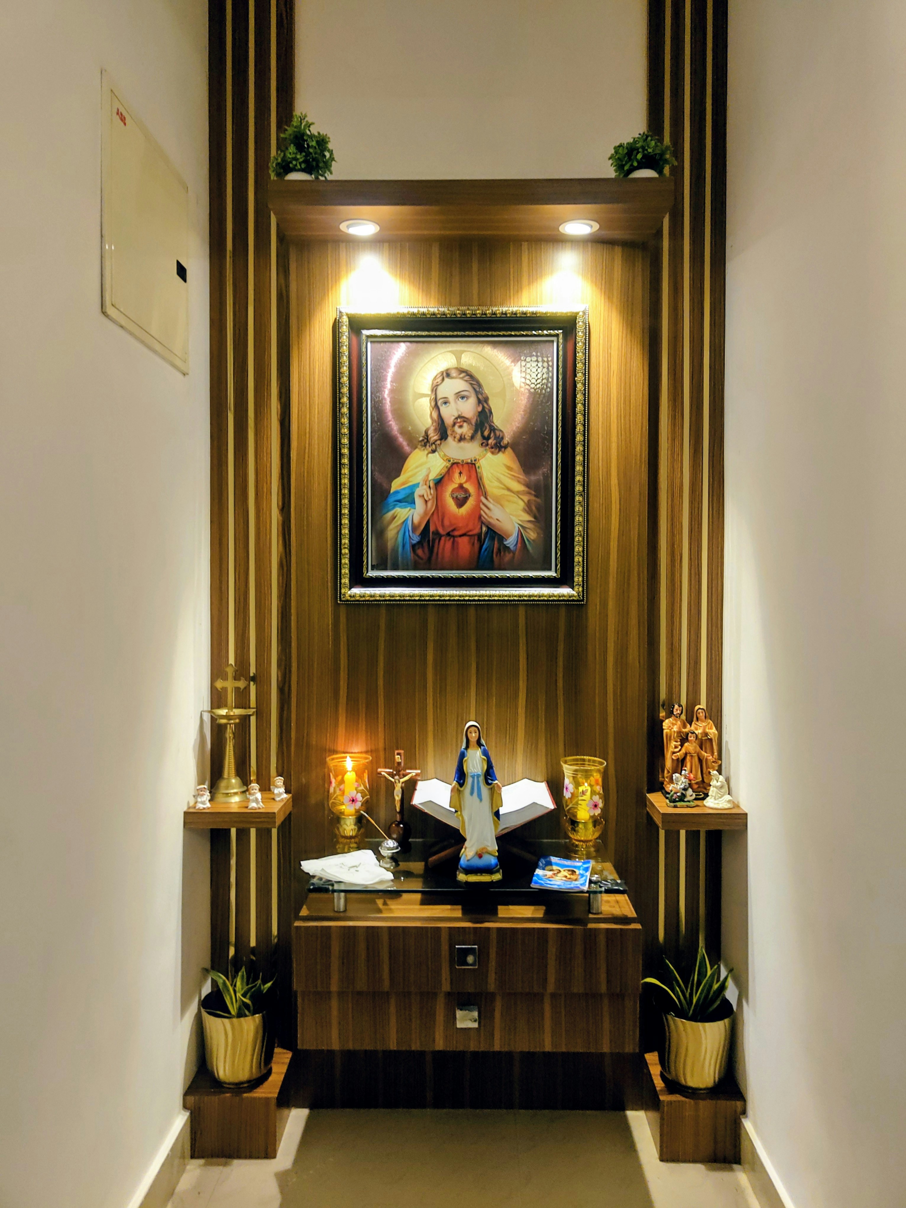 Centered Shrine: A Lit Portrait Framed by Warm Wood Tones