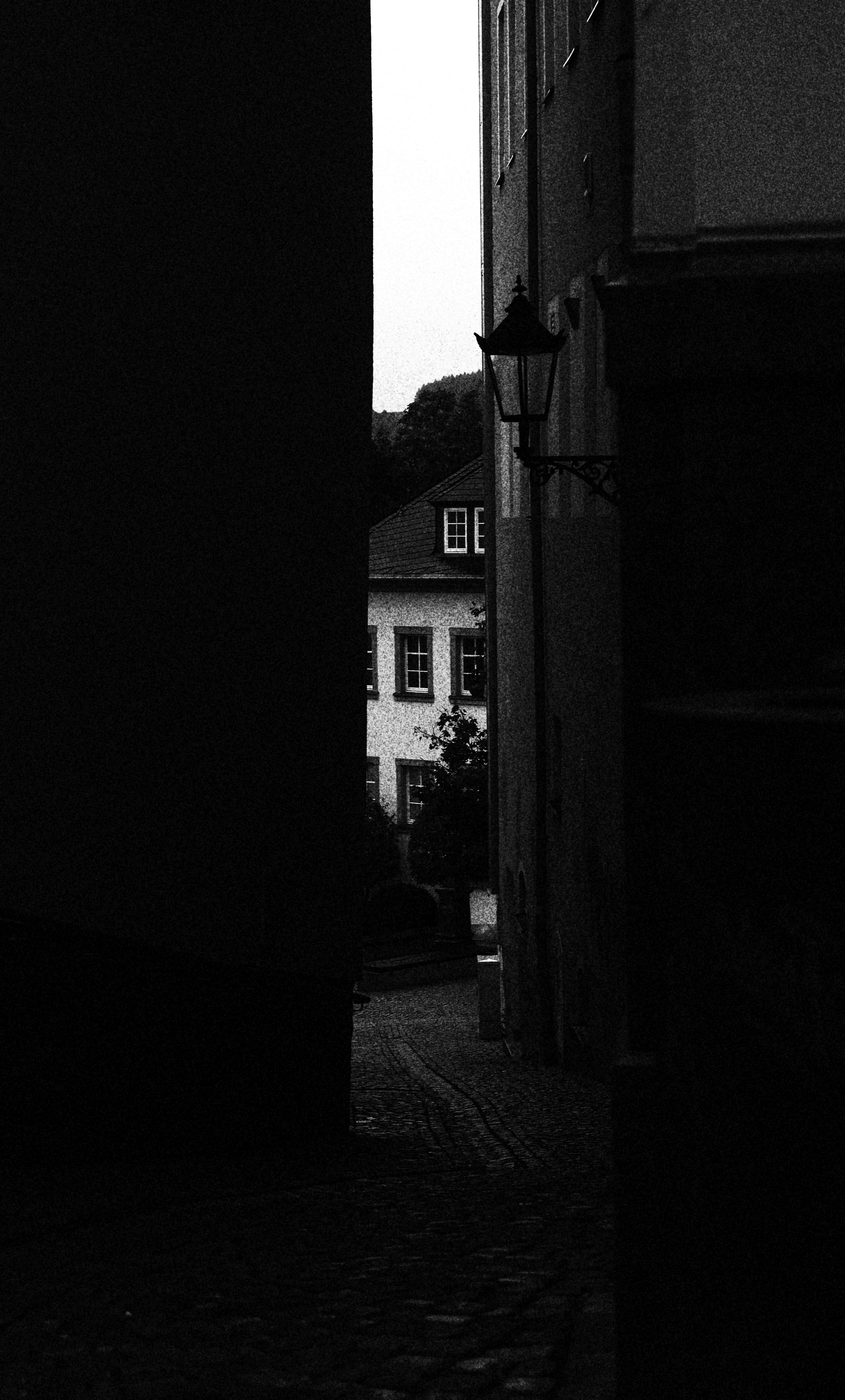 Hidden Courtyard Through Narrow Archway