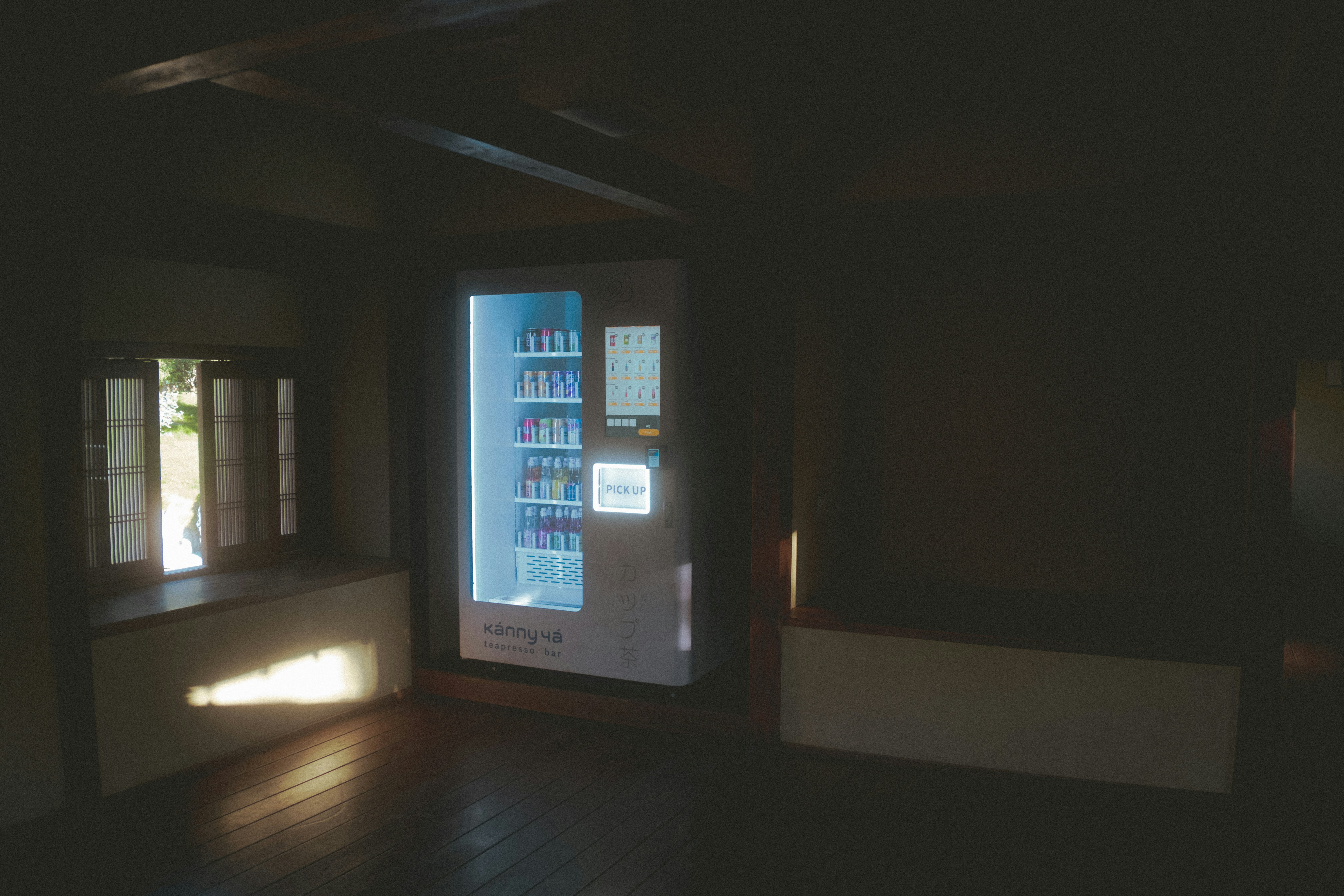 Dim Vending Nook: A Subtle Glimmer of Light in a Quiet Interior