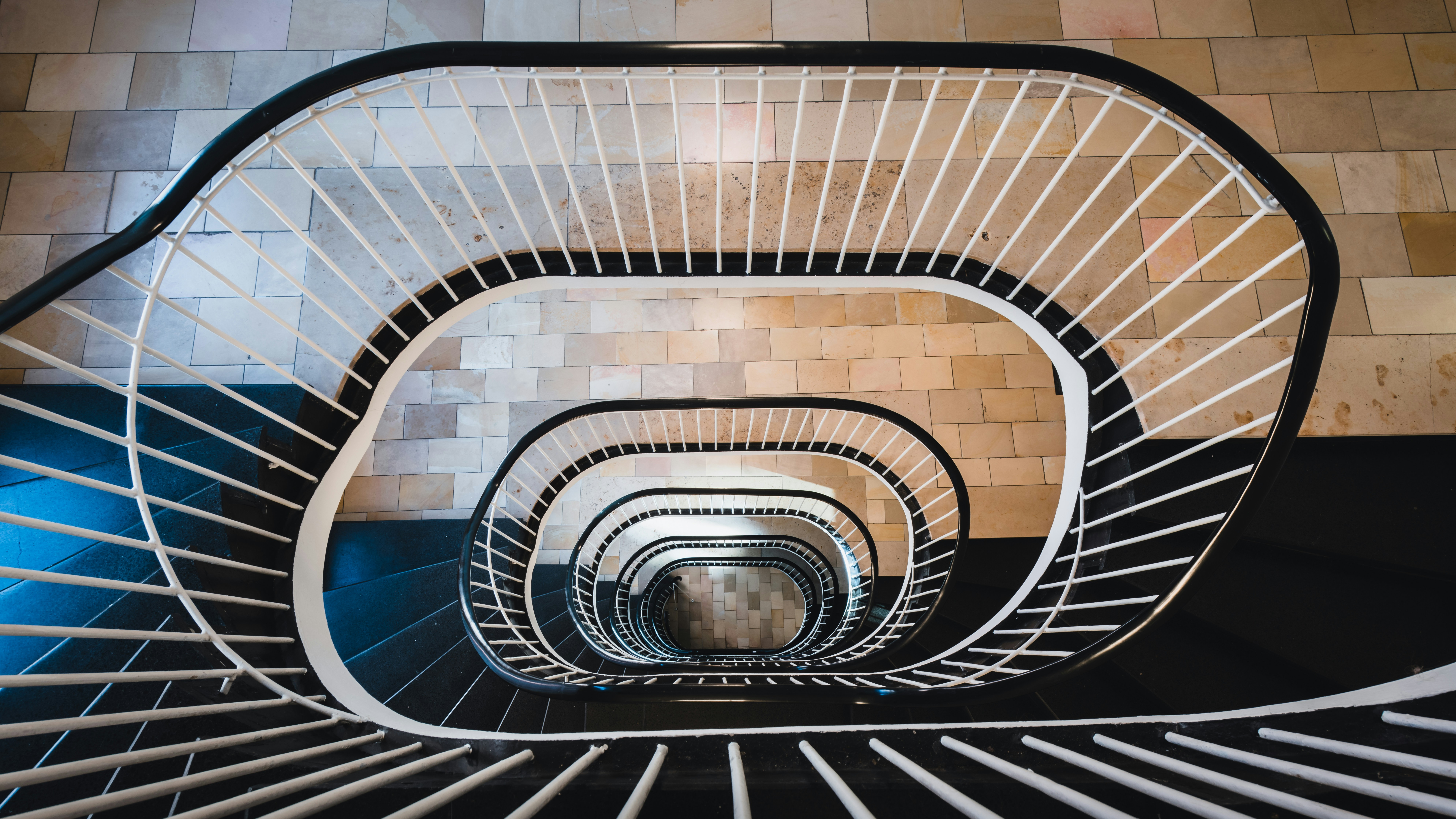 Spiral Descent: A Stairwell’s Infinite Frame