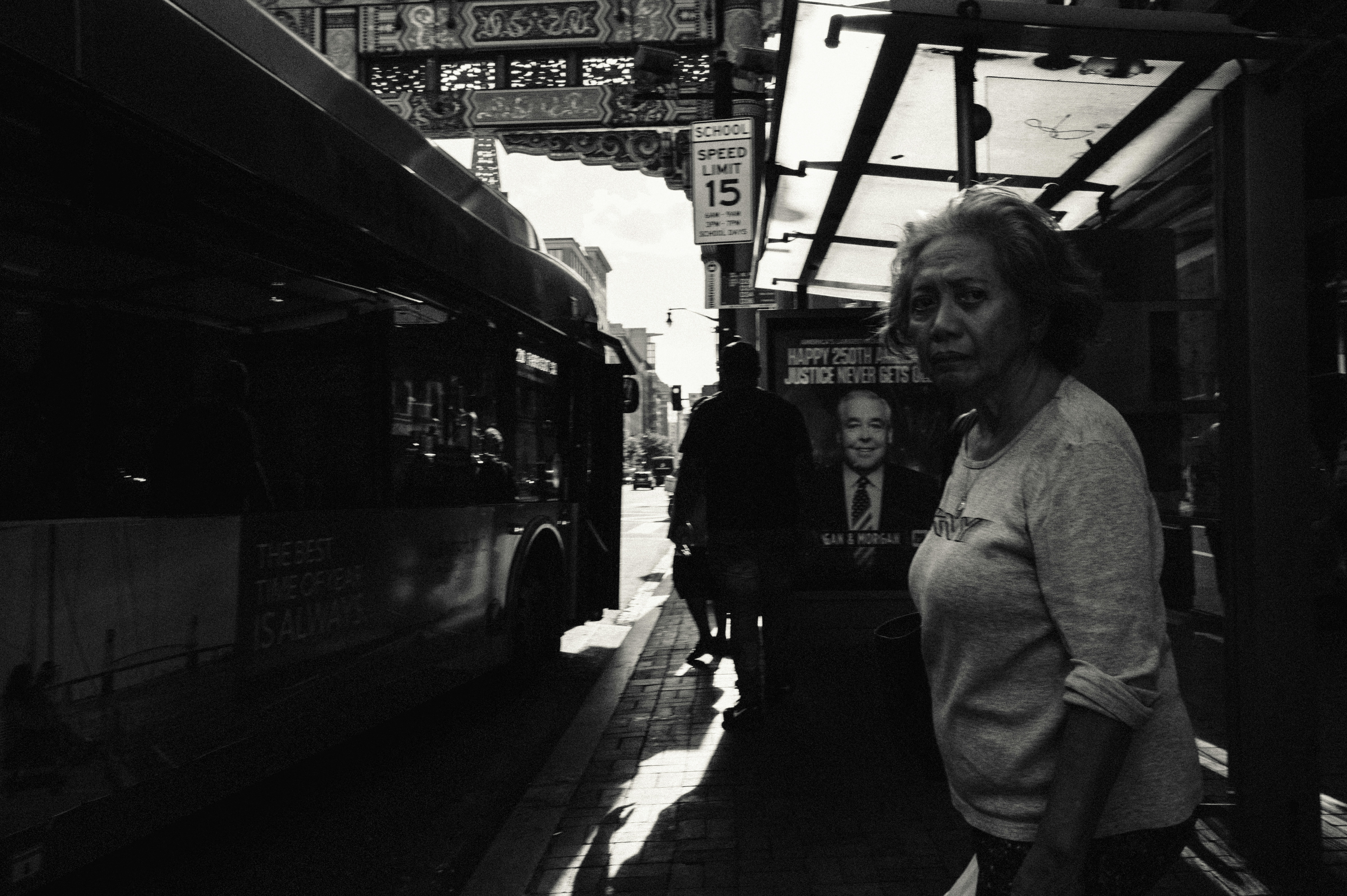 Street Echo: A Portrait in Monochrome Amid Neon & Signage