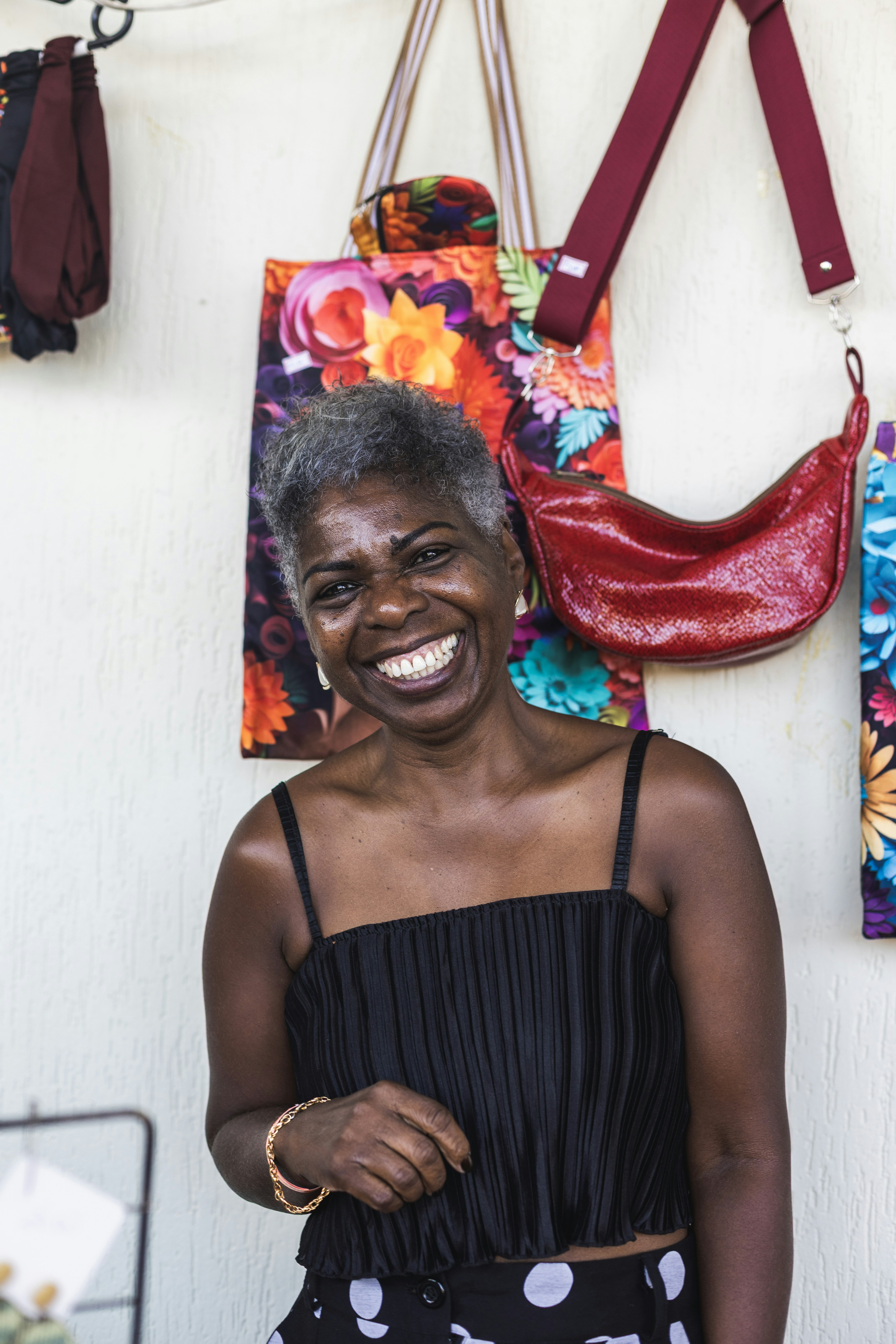 Joy Under Colorful Backdrops: Portrait of a Gracious Vendor