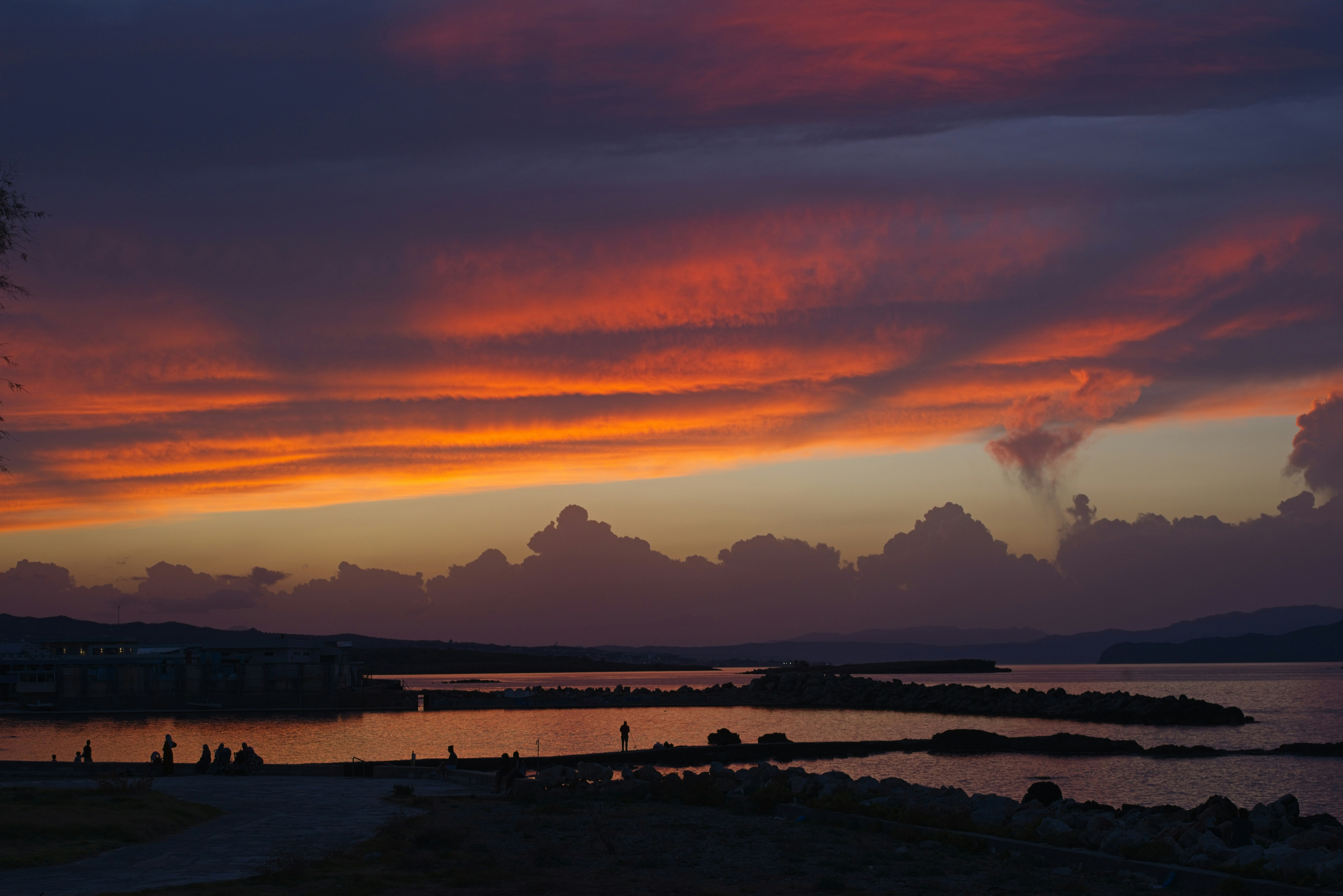 Fiery Horizon Over Quiet Boats at Dusk