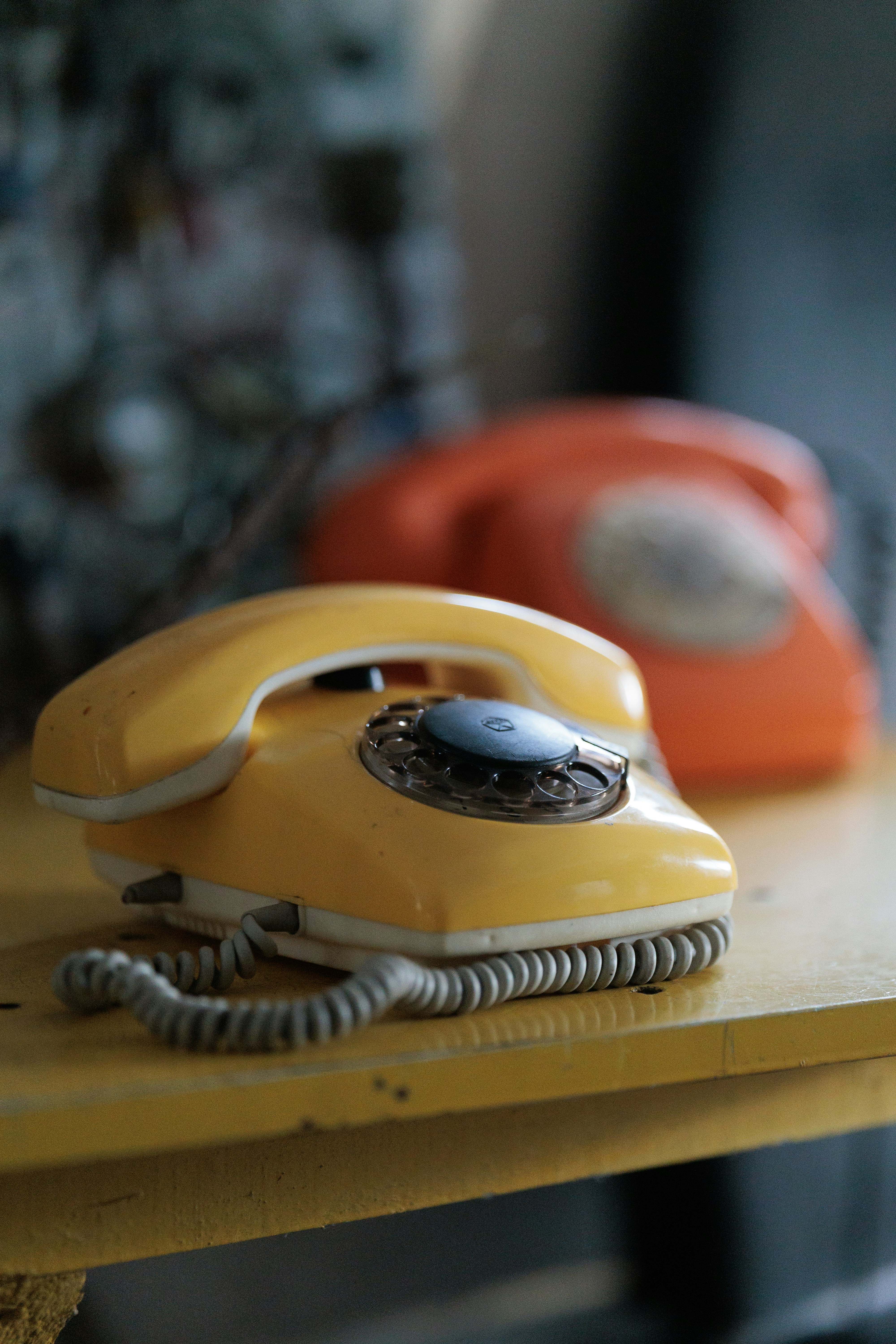 Yellow Rotary Dial Telephone in Focused foreground