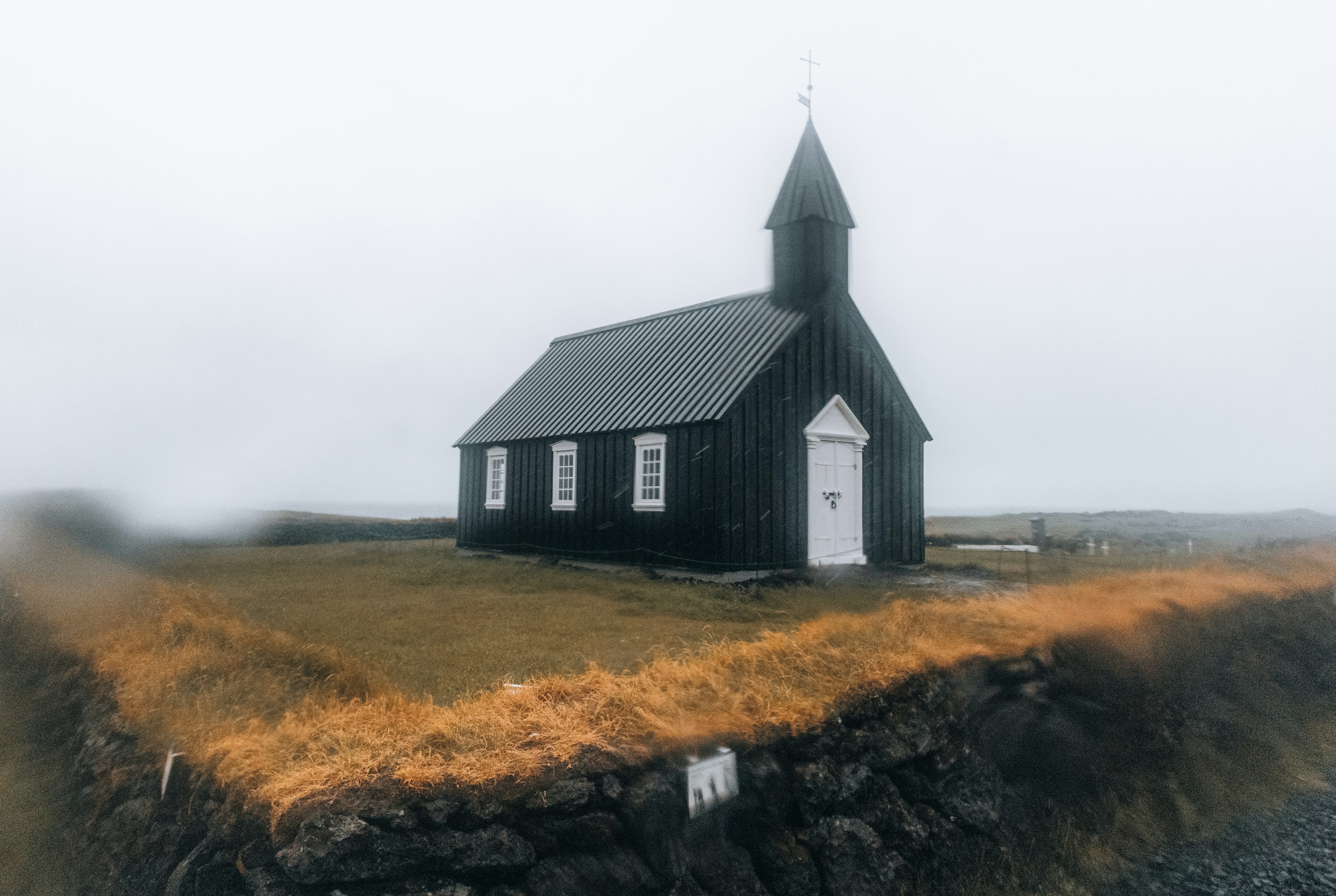 Stormy Coastal Chapel Adrift on a Sea of Mist