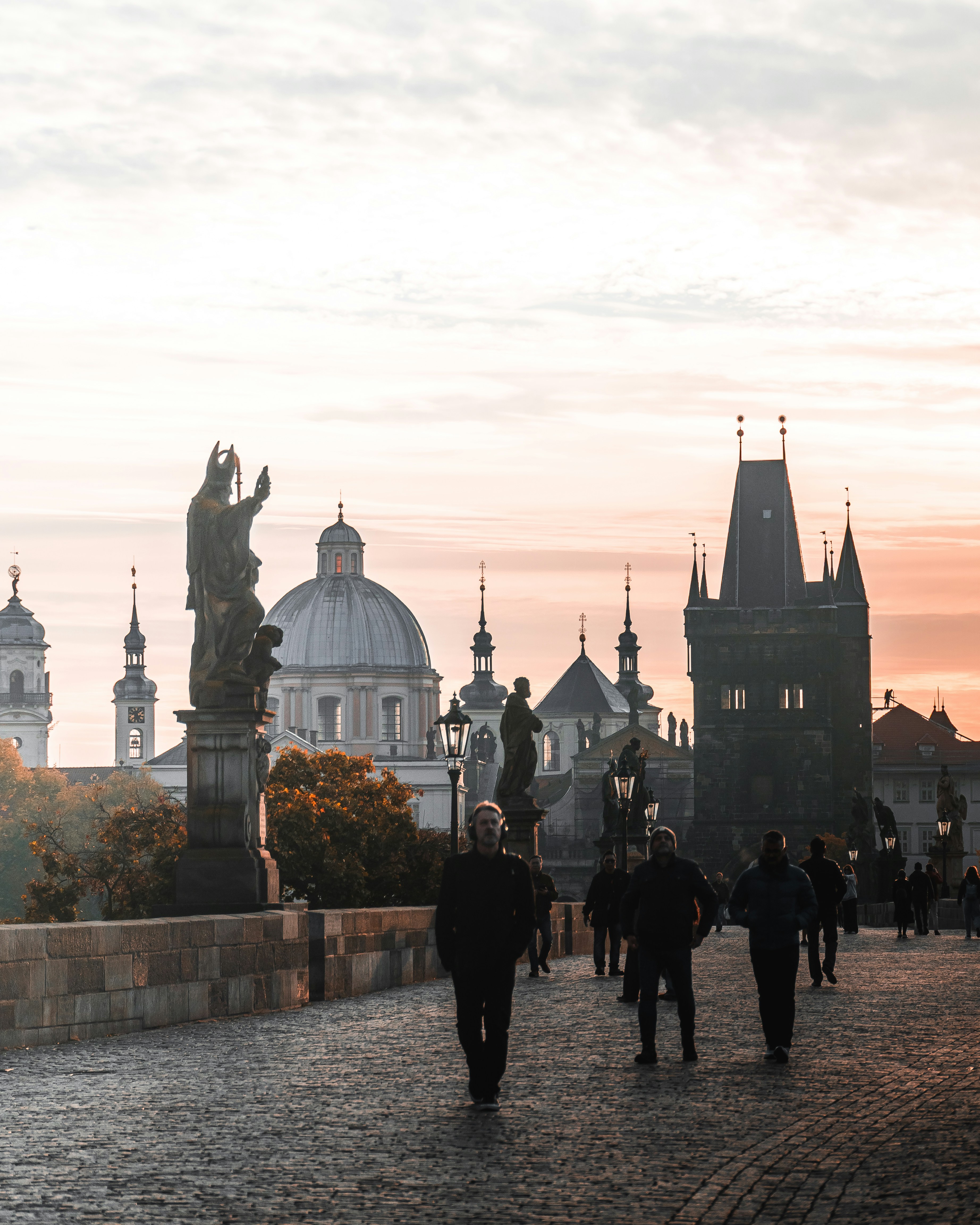 Sunset Stroll under Prague’s Stone Guardians